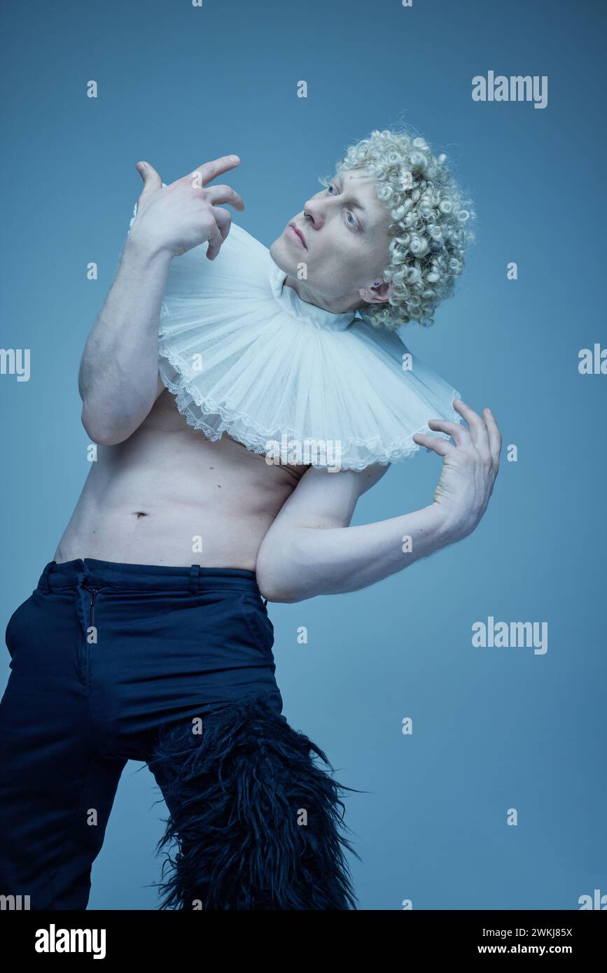 Man with curly hair exhibiting Avant-Garde look with classical touch ...