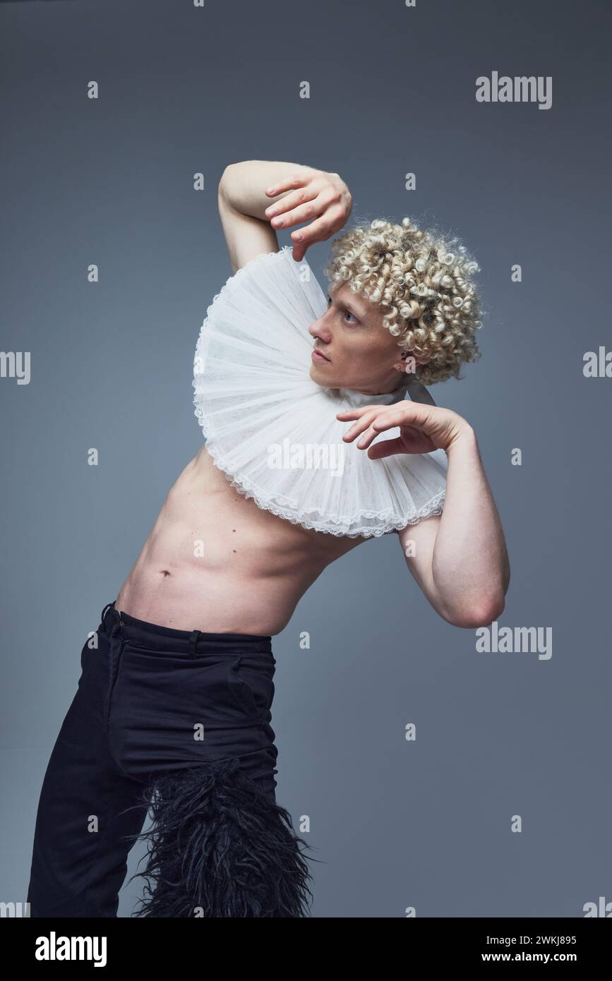 Artistic male model blending historical and contemporary fashion with ...