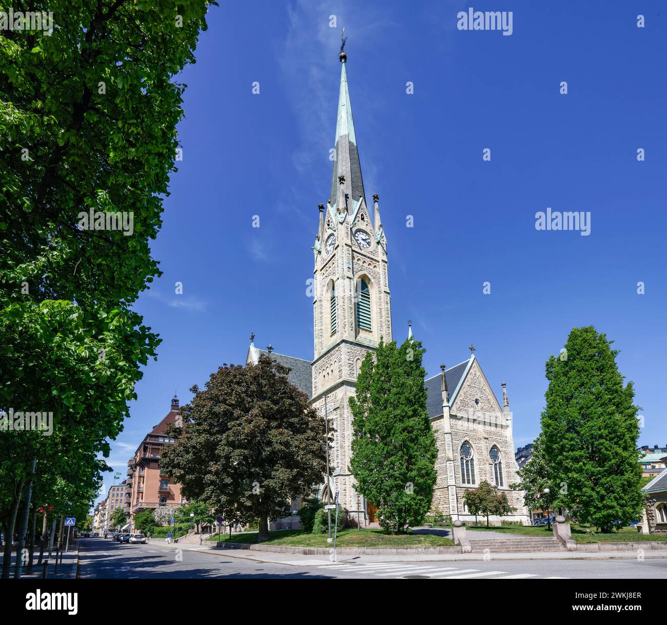 Trees surround Oscarskyrkan, Oscar's Church, a gothic revival style ...