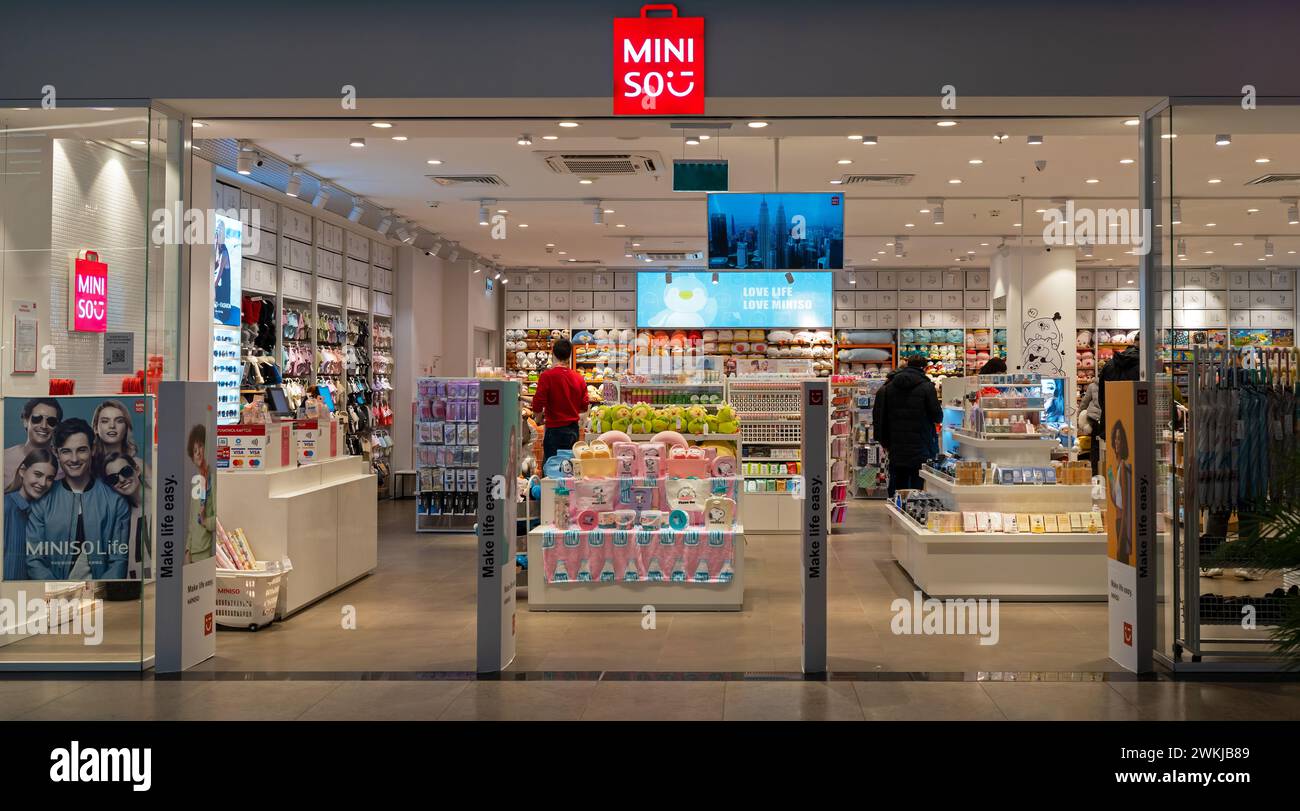 Miniso store logo signboard above the entrance to the shop. Minsk ...