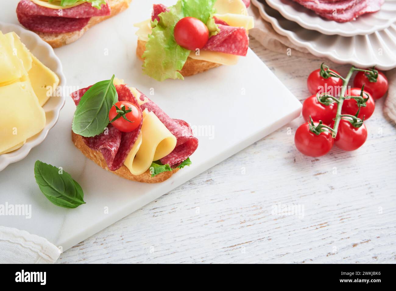 Salami sandwich. Delicious toasted sandwiches with slice salami, cheddar cheese lettuce and ...