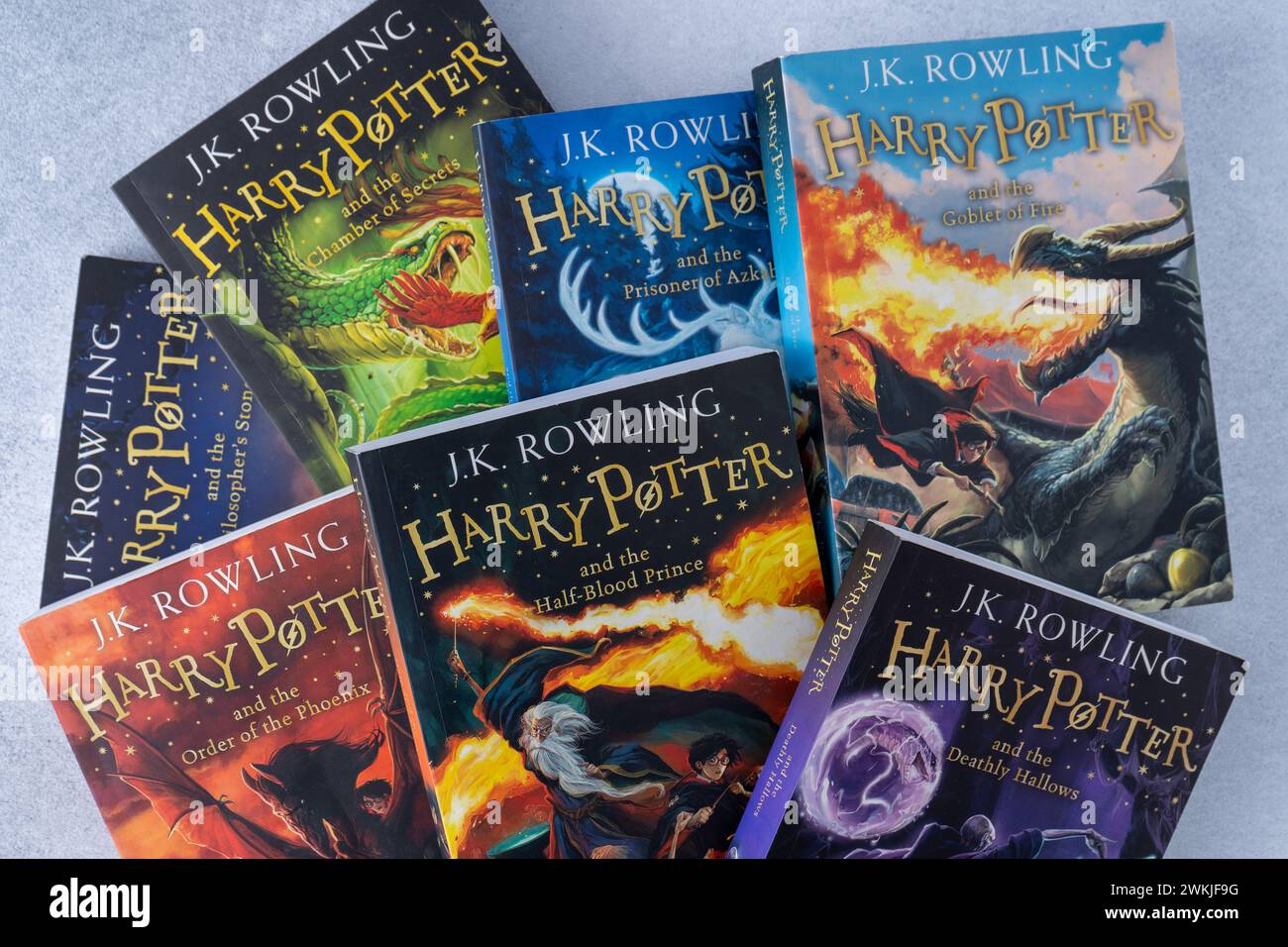 A stack of books about Harry Potter by writer JK Rowling. Collection ...
