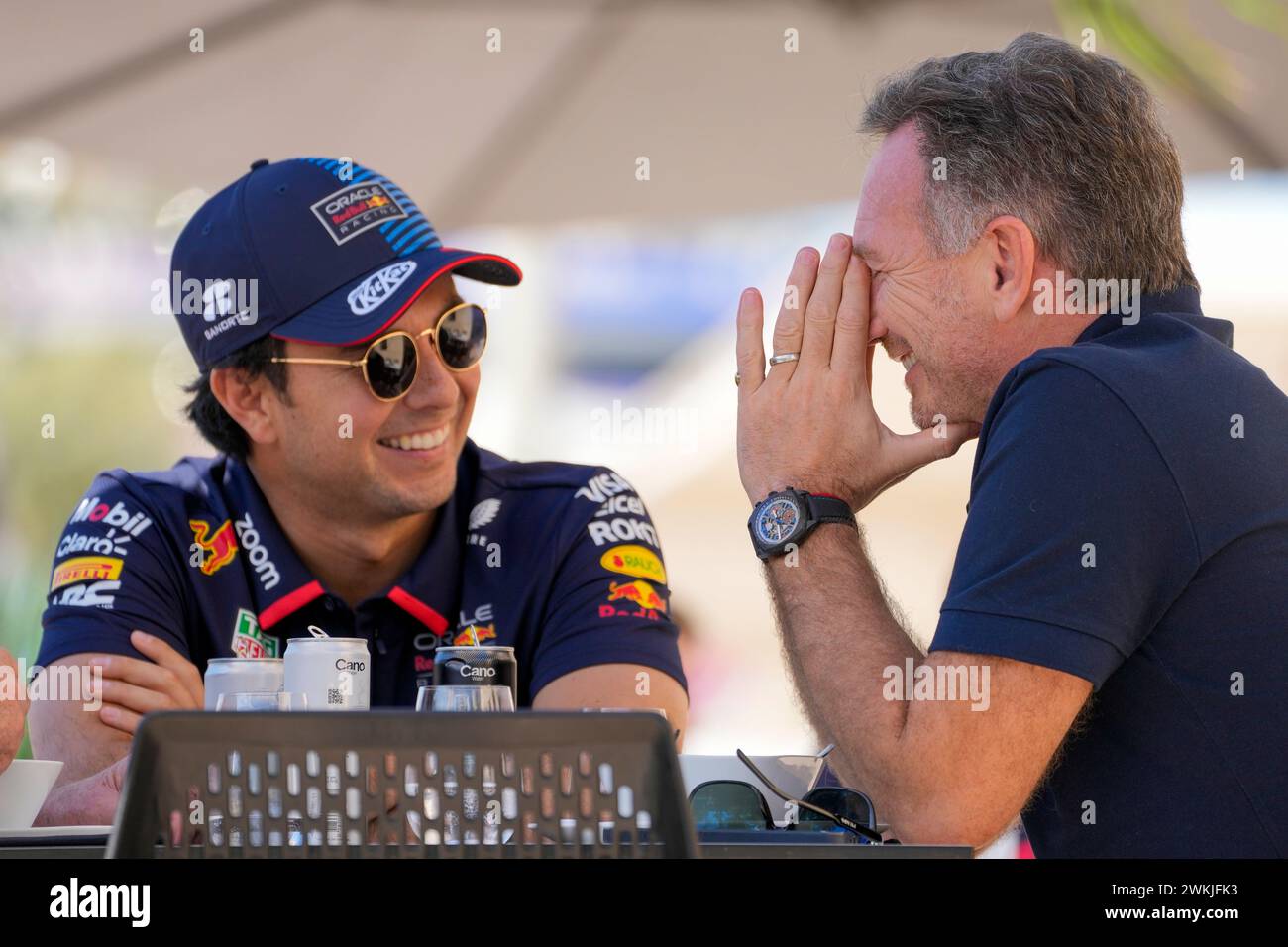 Red Bull team principal Christian Horner, right, chats with Red Bull driver Sergio Perez of ...