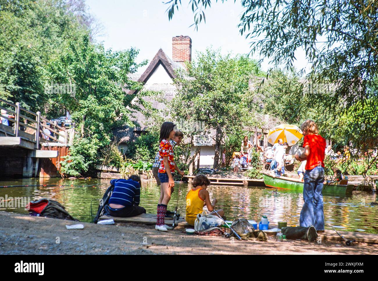 Children fishing in River Stour, Flatford Mill, Suffolk, England, Uk ...