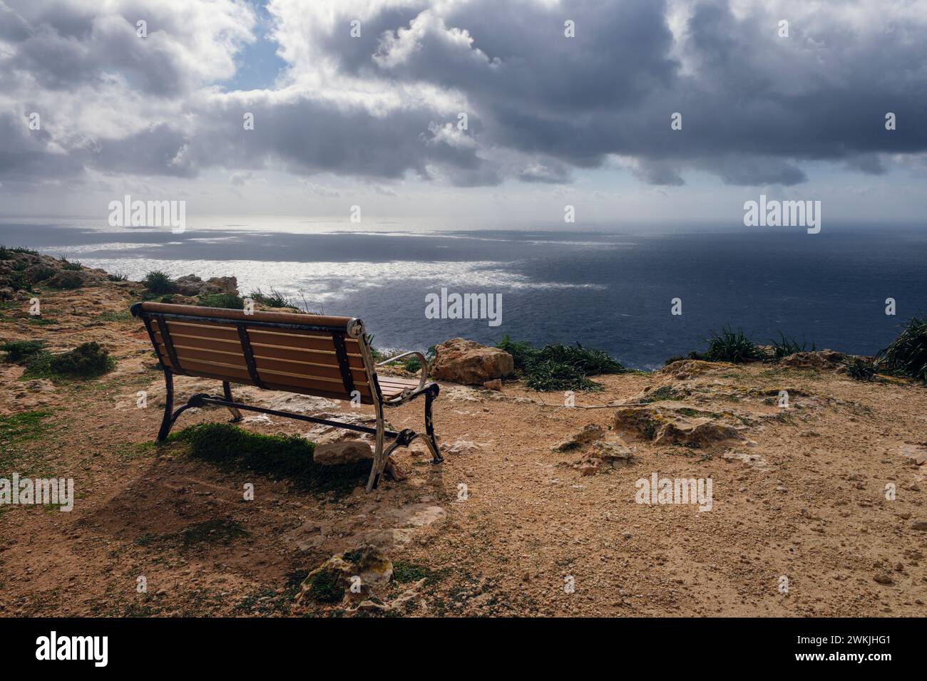A bench at a viewpoint overlooking the Mediterranean Sea on the edge of ...