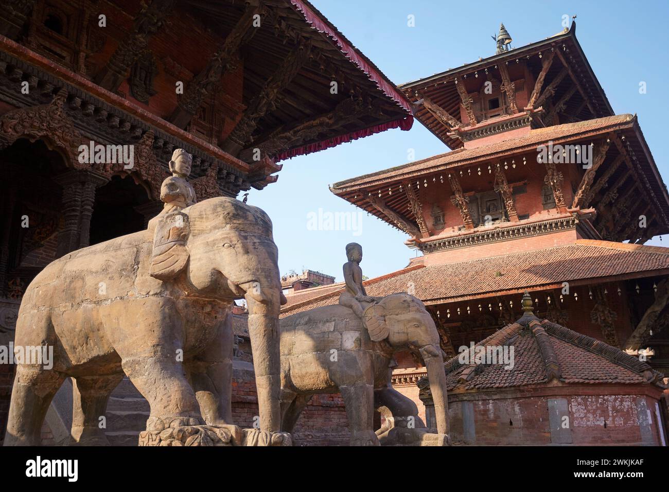 Temple's sculptures in the Durbar square of Patan at sunset, Lalitpur ...