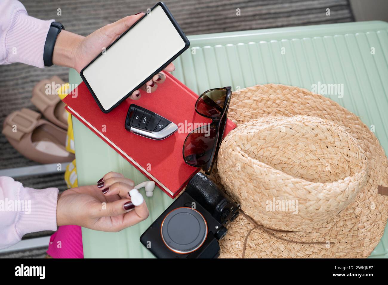 Packing for a trip and showing smart phone with blank screen Stock ...