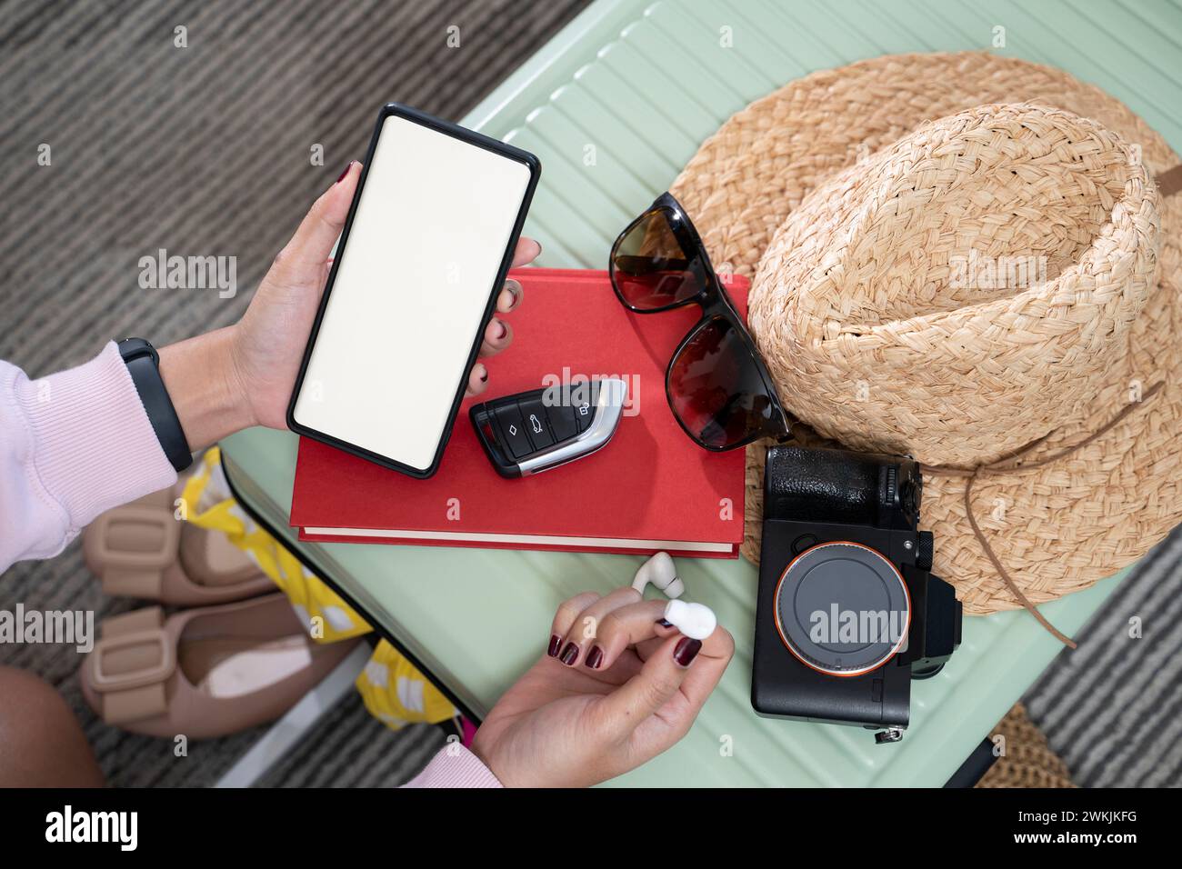 Packing for a trip and showing smart phone with blank screen Stock ...