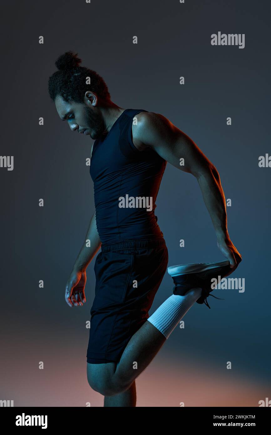 appealing sporty african american man in uniform stretching muscles ... appealing sporty african american man in uniform stretching muscles ...