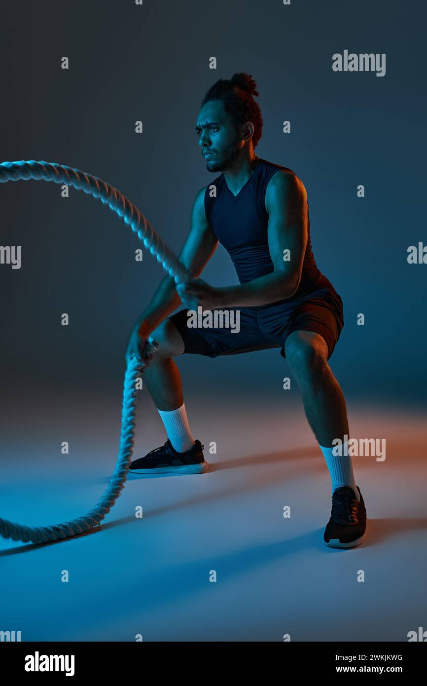 attractive young african american man in black sport uniform training ...
