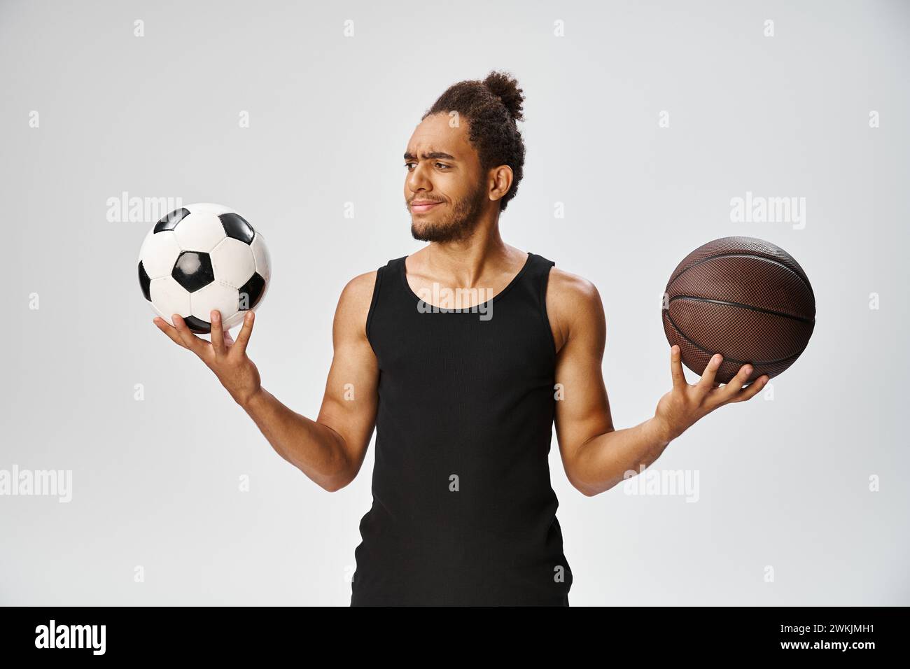 African model holding a football hi-res stock photography and images ...