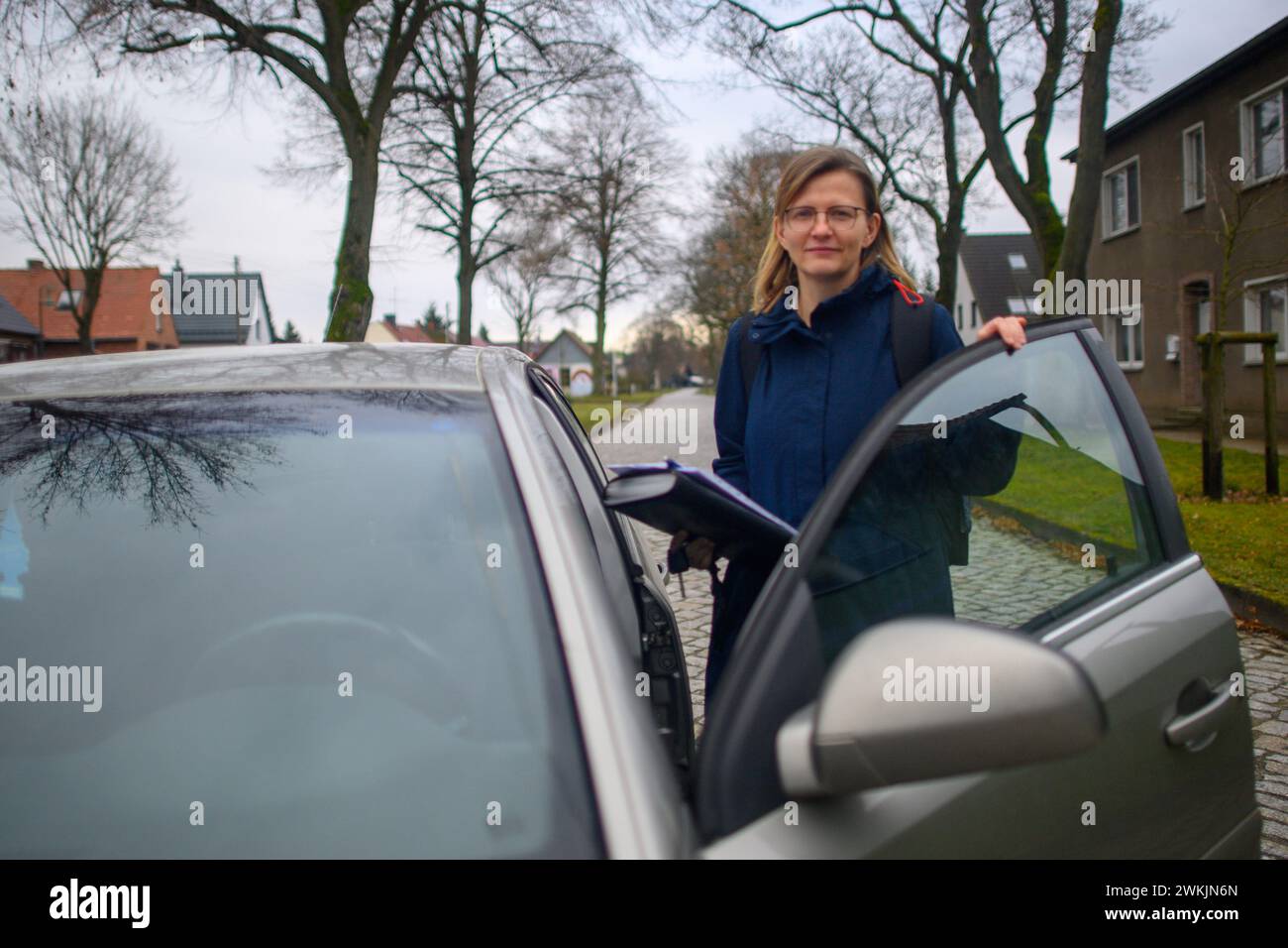 Born, Germany. 21st Feb, 2024. Care assessor Jeannine Mittendorf gets ...