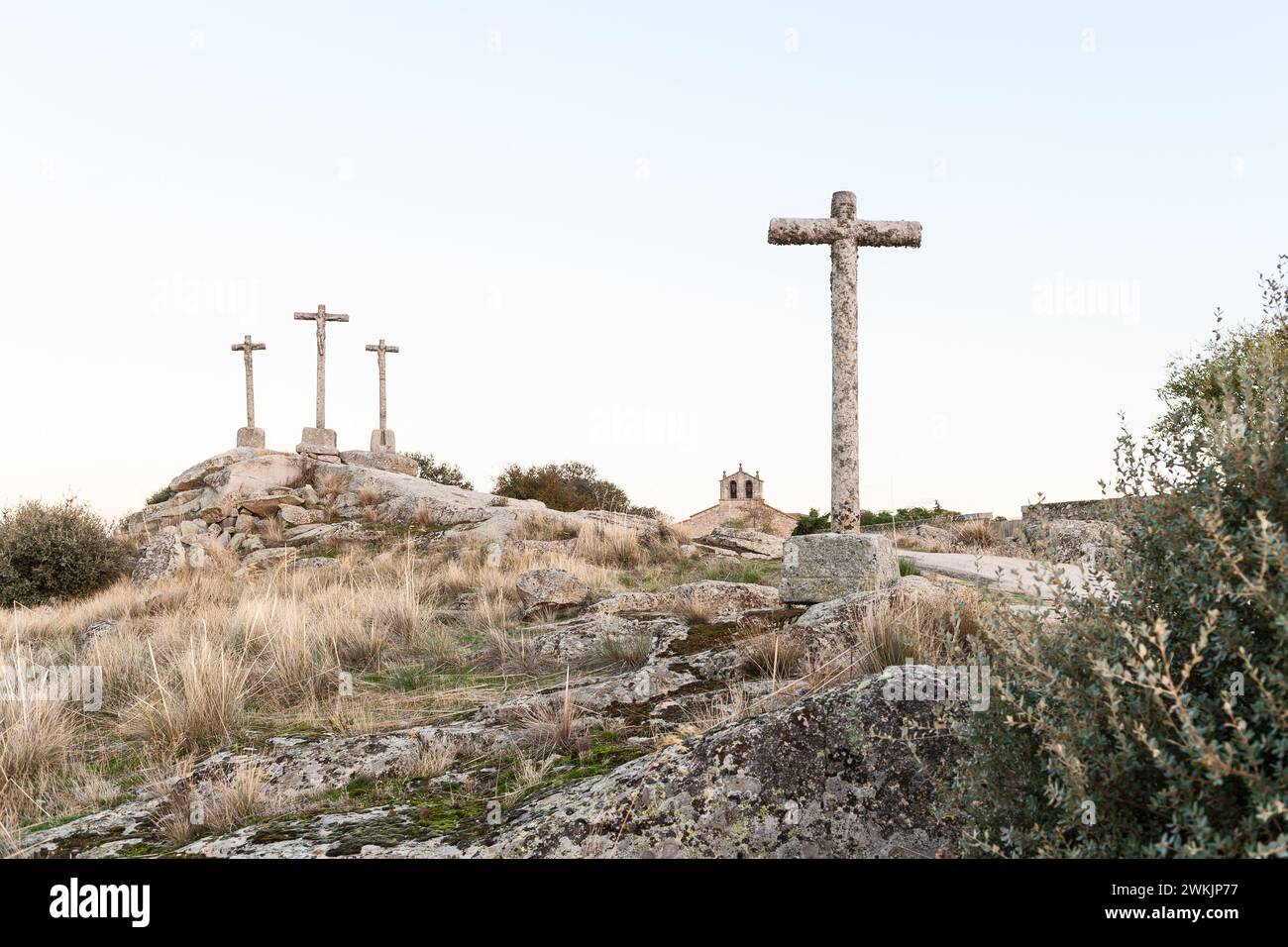 Three Crosses of carved stone on granite rock at dusk of Heaven Stock ...