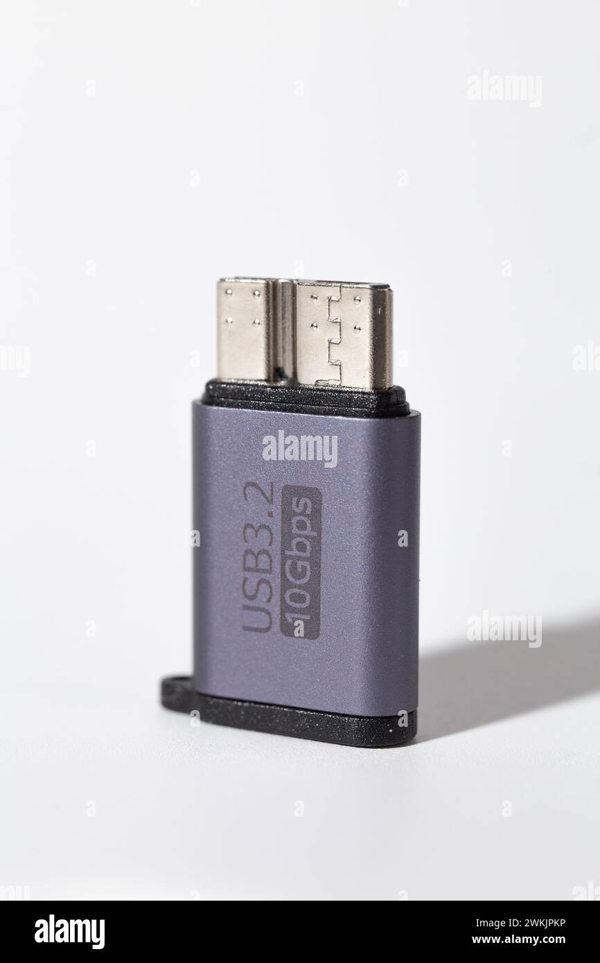 The image shows a dark grey USB 3.2 flash drive with a Type-C connector ...