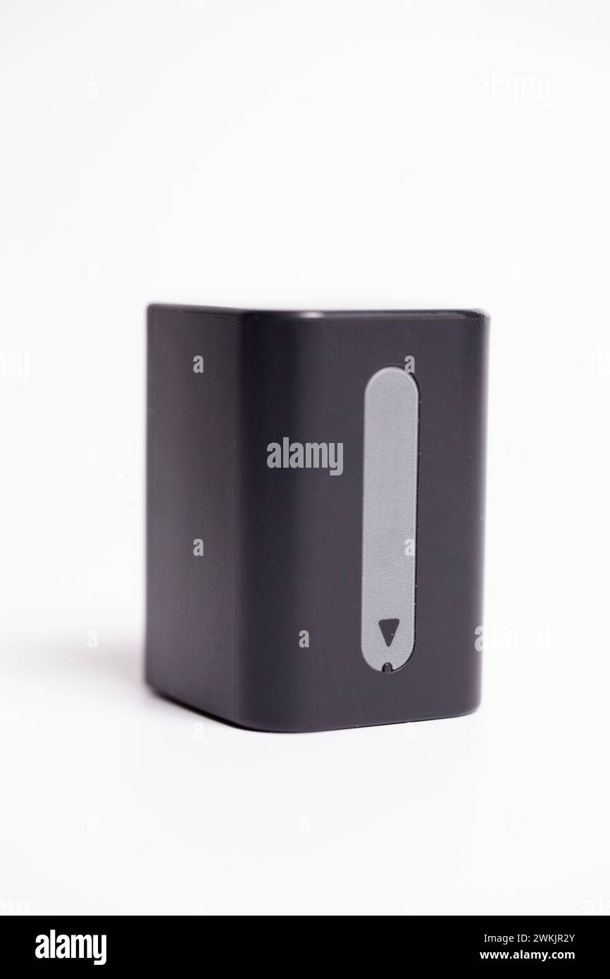 Black rectangular camera battery isolated on white background. The ...