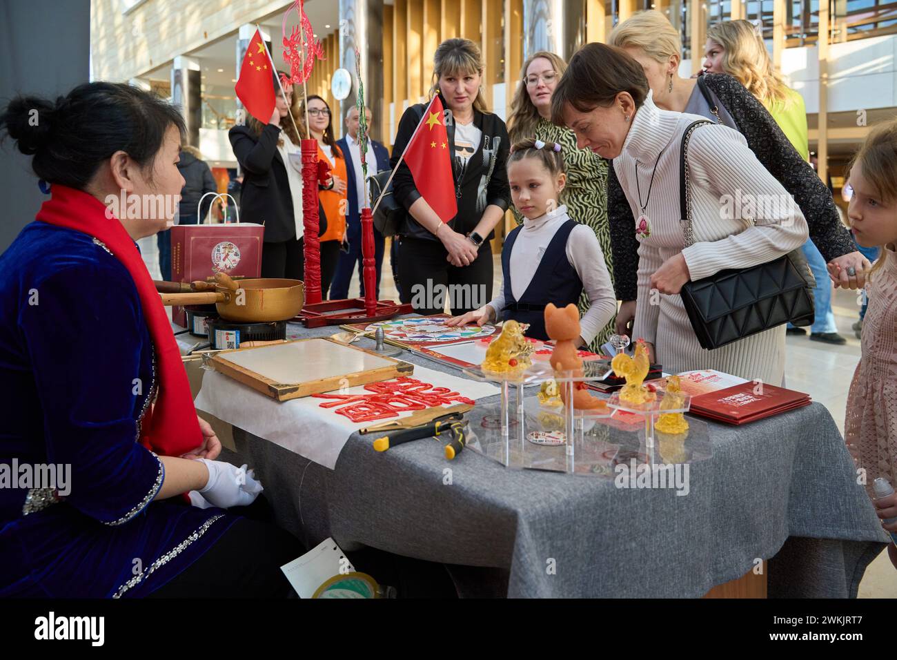 Vladivostok, Russia. 20th Feb, 2024. People visit a booth displaying ...