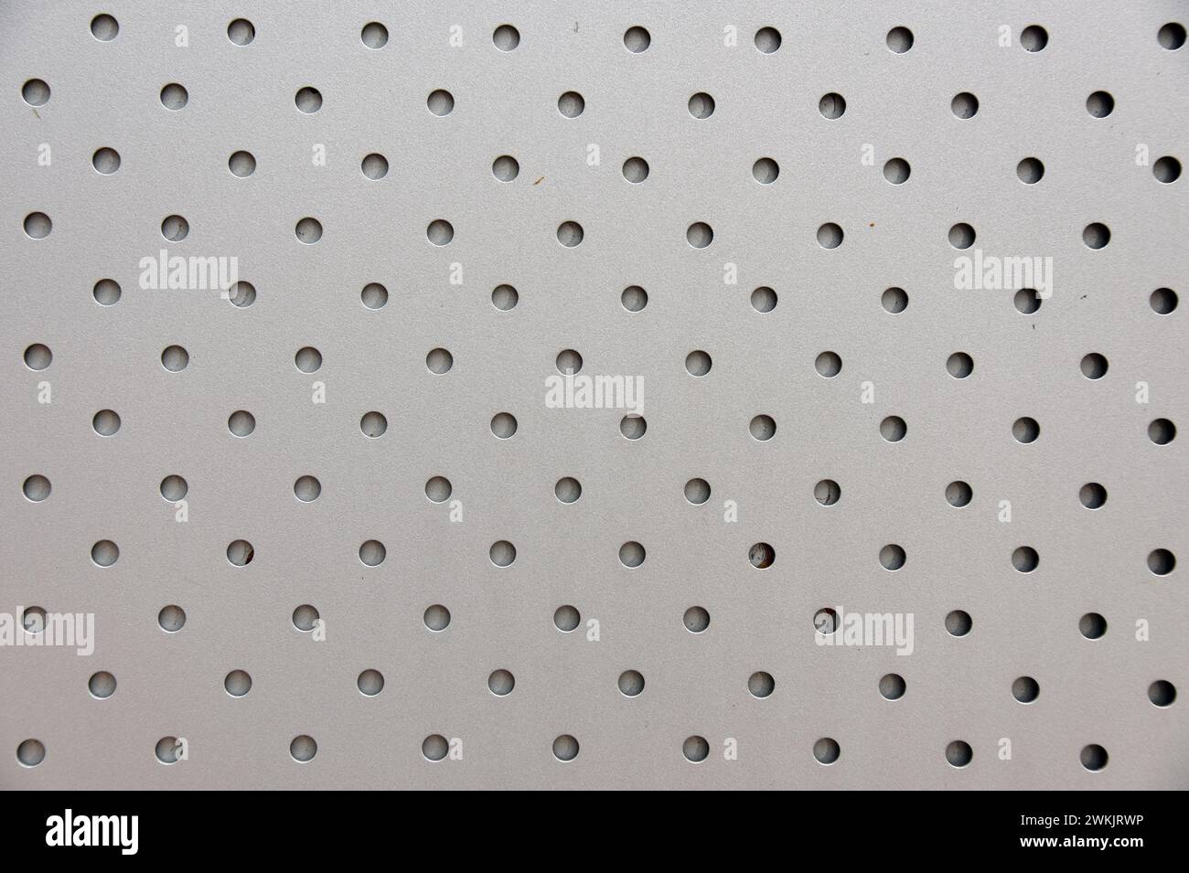 Holes and Dots in a Metal Wall Stock Photo - Alamy