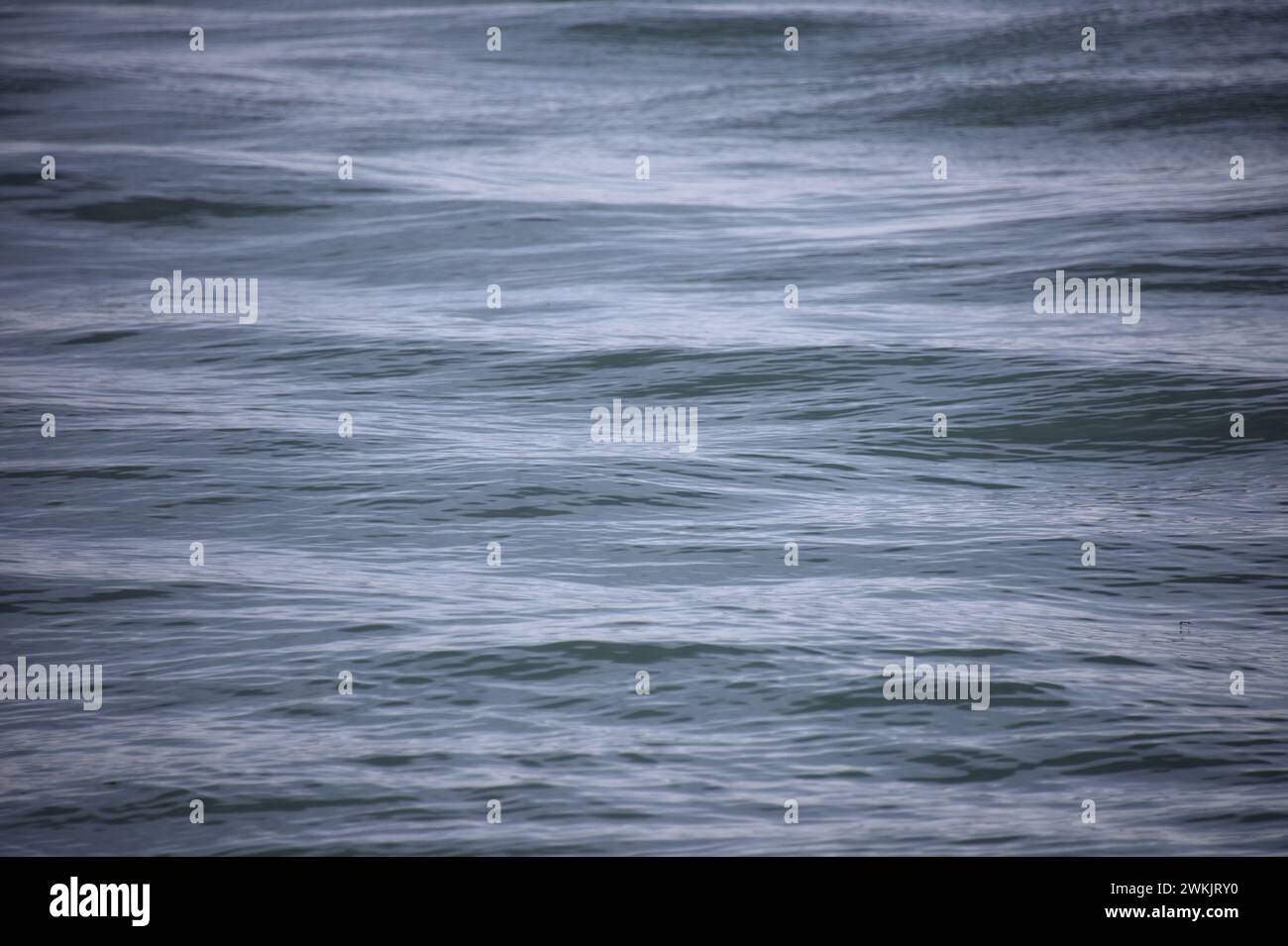 Thewaves gently swelling in the ocean Stock Photo - Alamy