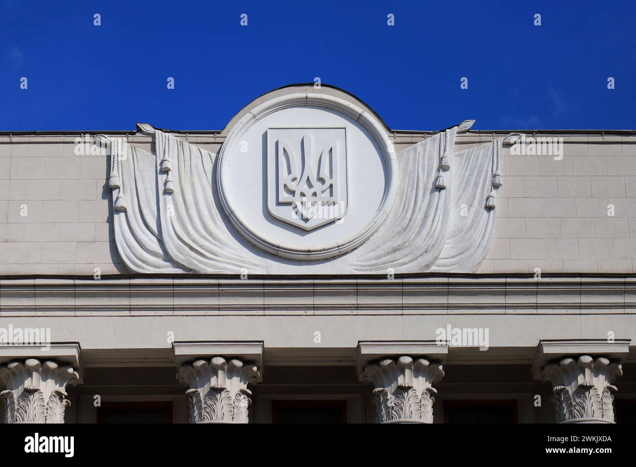 The coat of arms of Ukraine on building of Ukrainian parliament. The ...