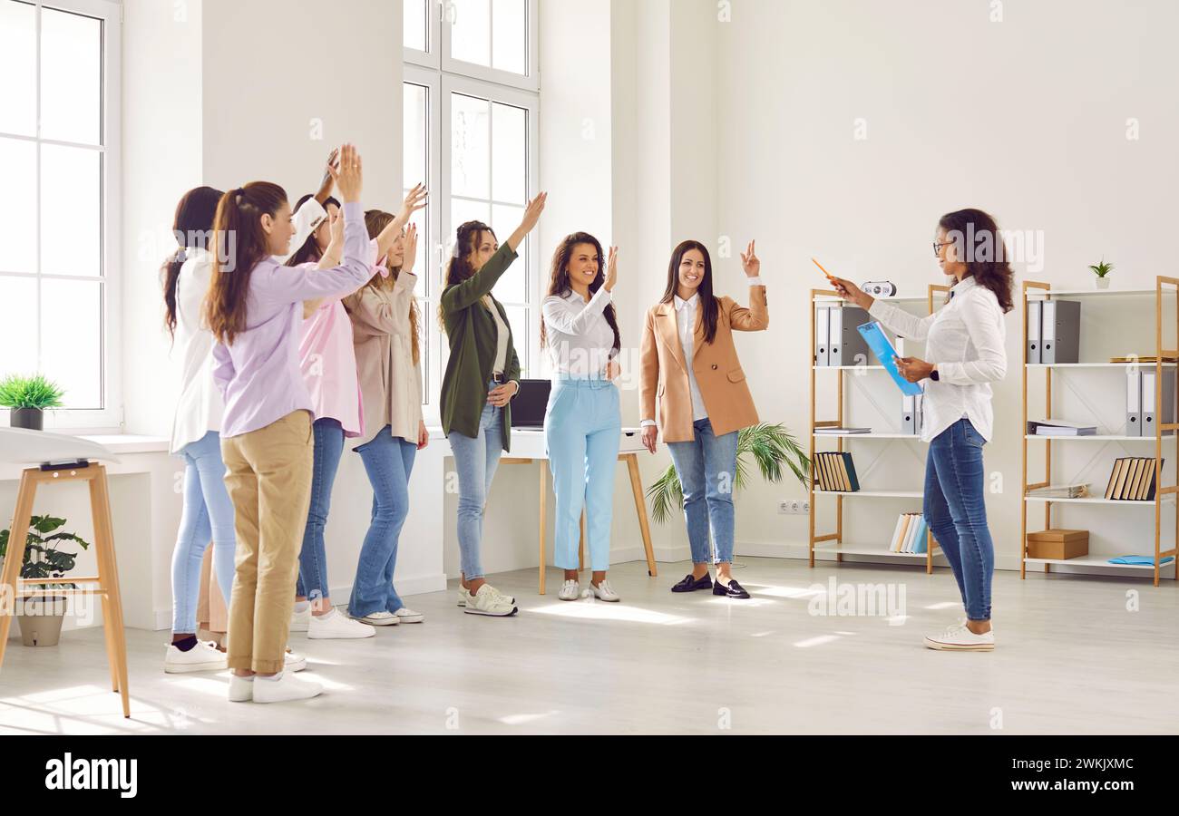 Female raising hand vote meeting hi-res stock photography and images ...