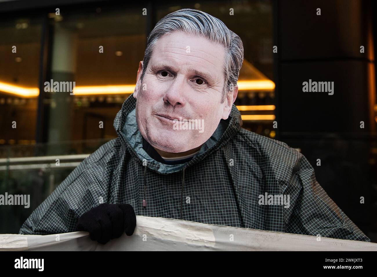 London, UK. 21st February, 2024. A pro-Palestinian activist wearing a ...