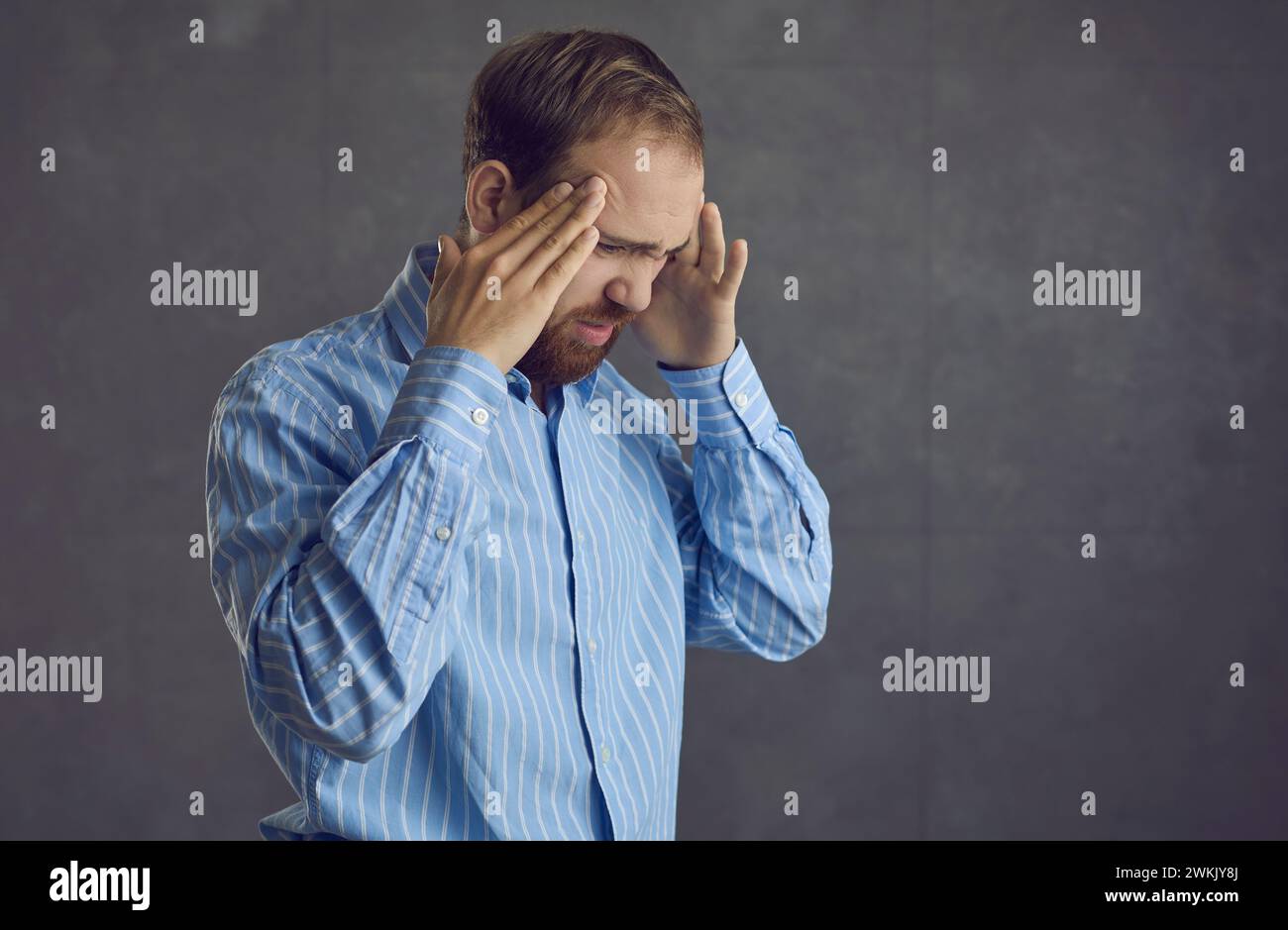 Tired businessman suffers from headache hi-res stock photography and ...