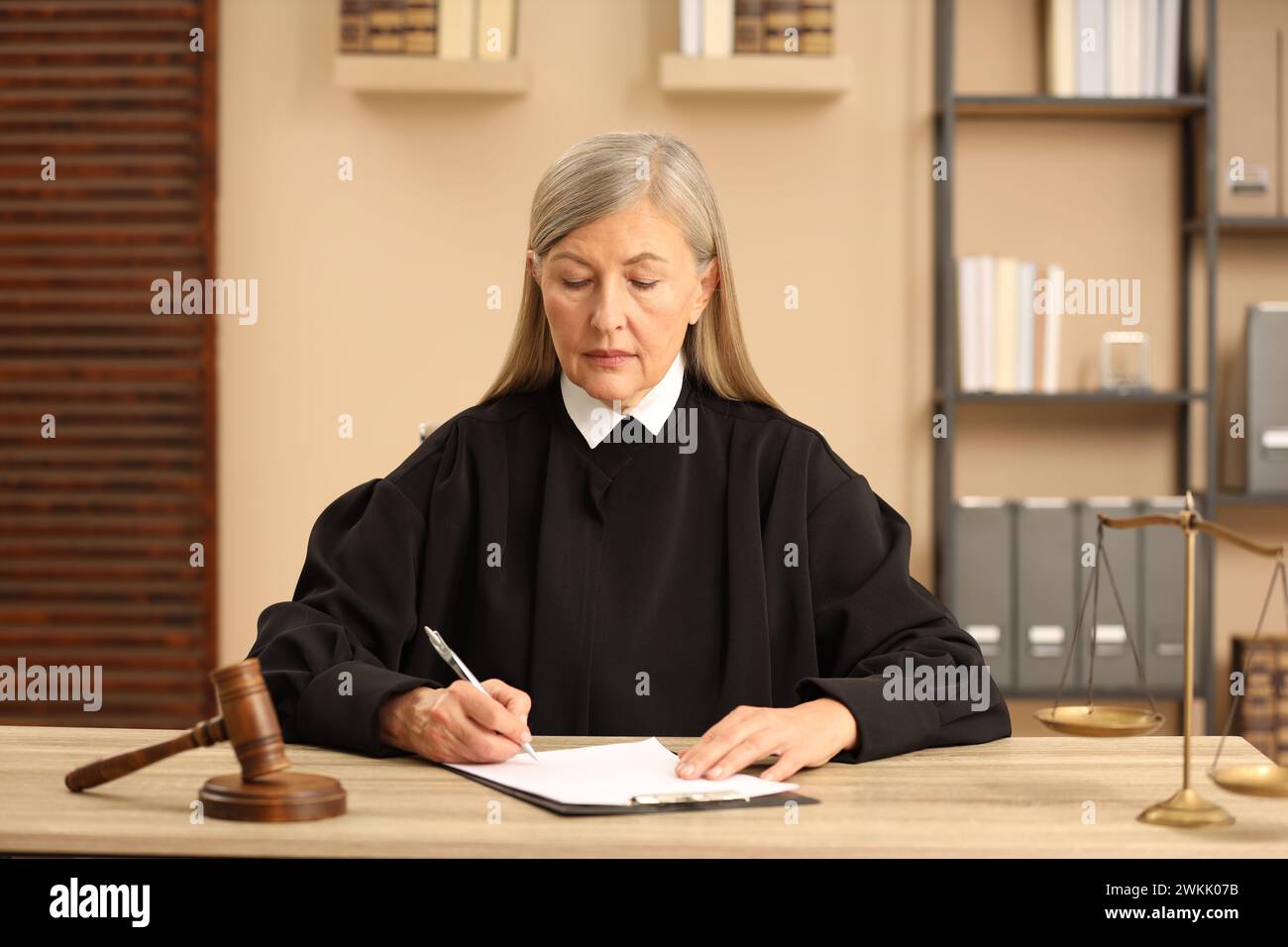 Mature female judge scales hi-res stock photography and images - Alamy