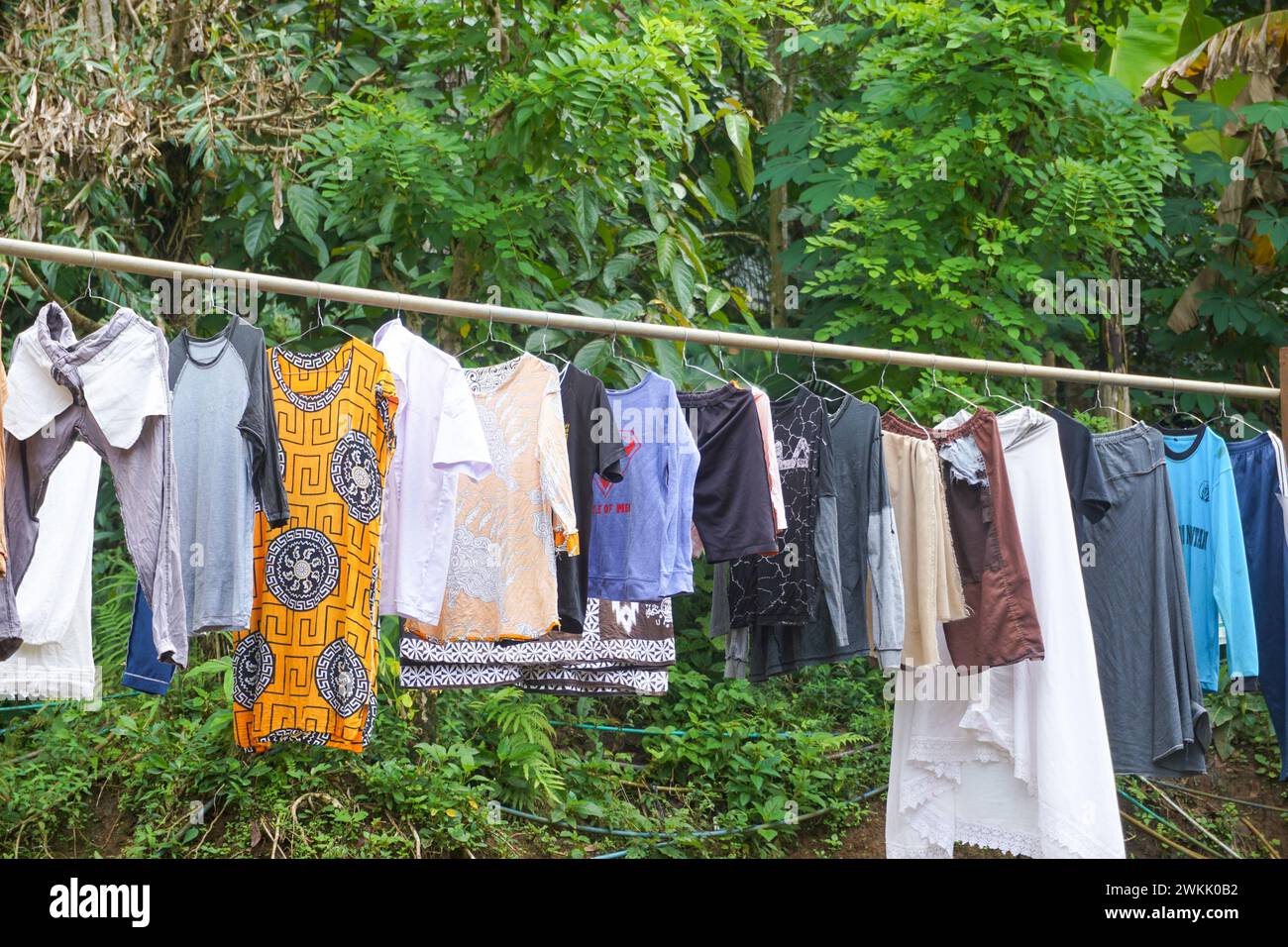 Drying clothes that have been washed manually using the sun Stock Photo ...