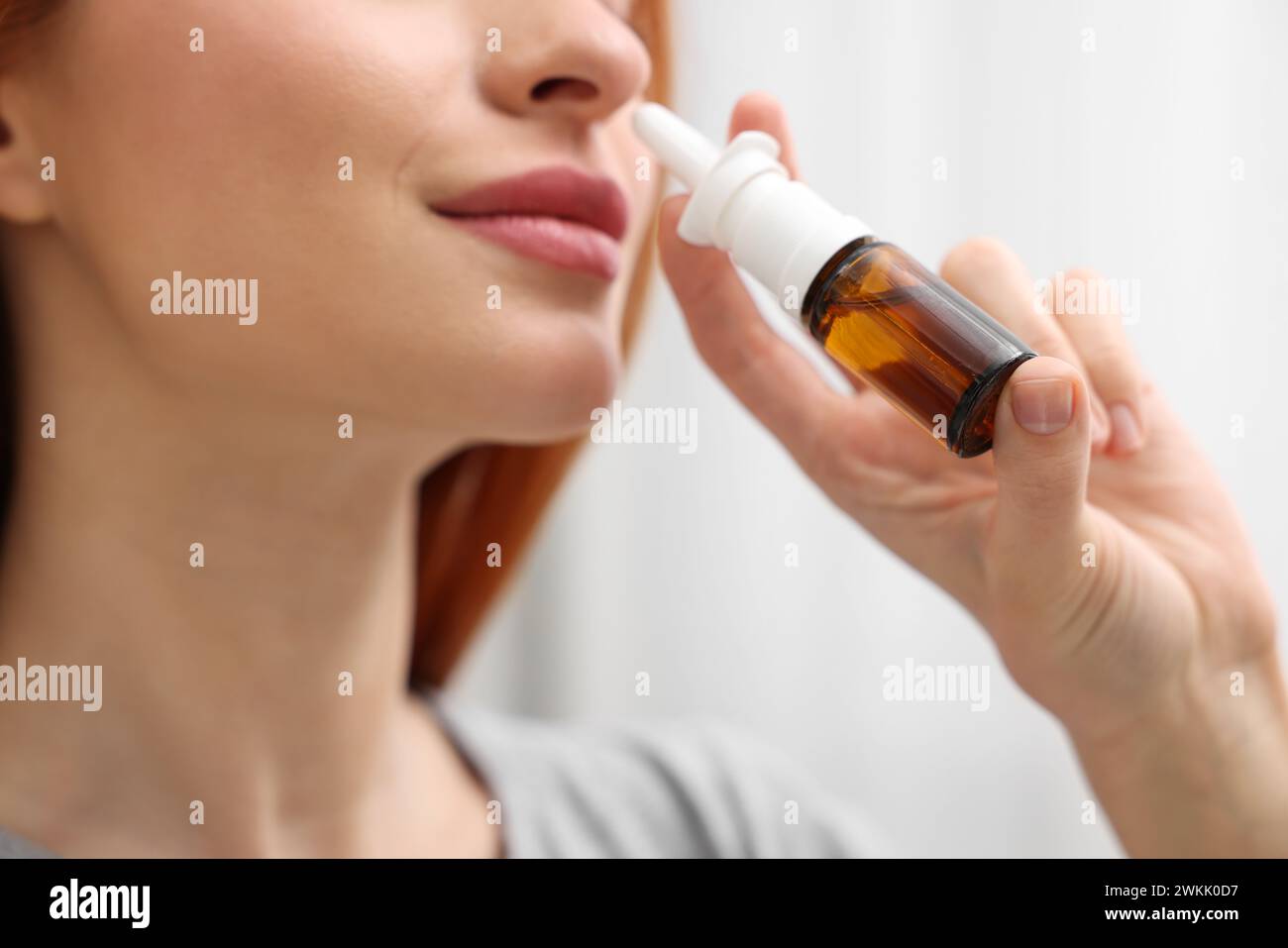 Medical drops. Woman using nasal spray at home, closeup Stock Photo - Alamy