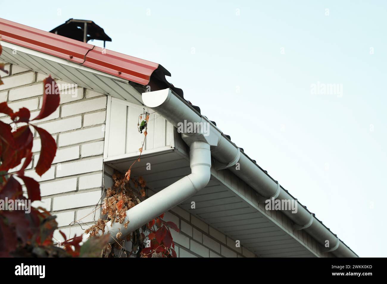 Rain gutter system with drainpipe on house outdoors Stock Photo - Alamy