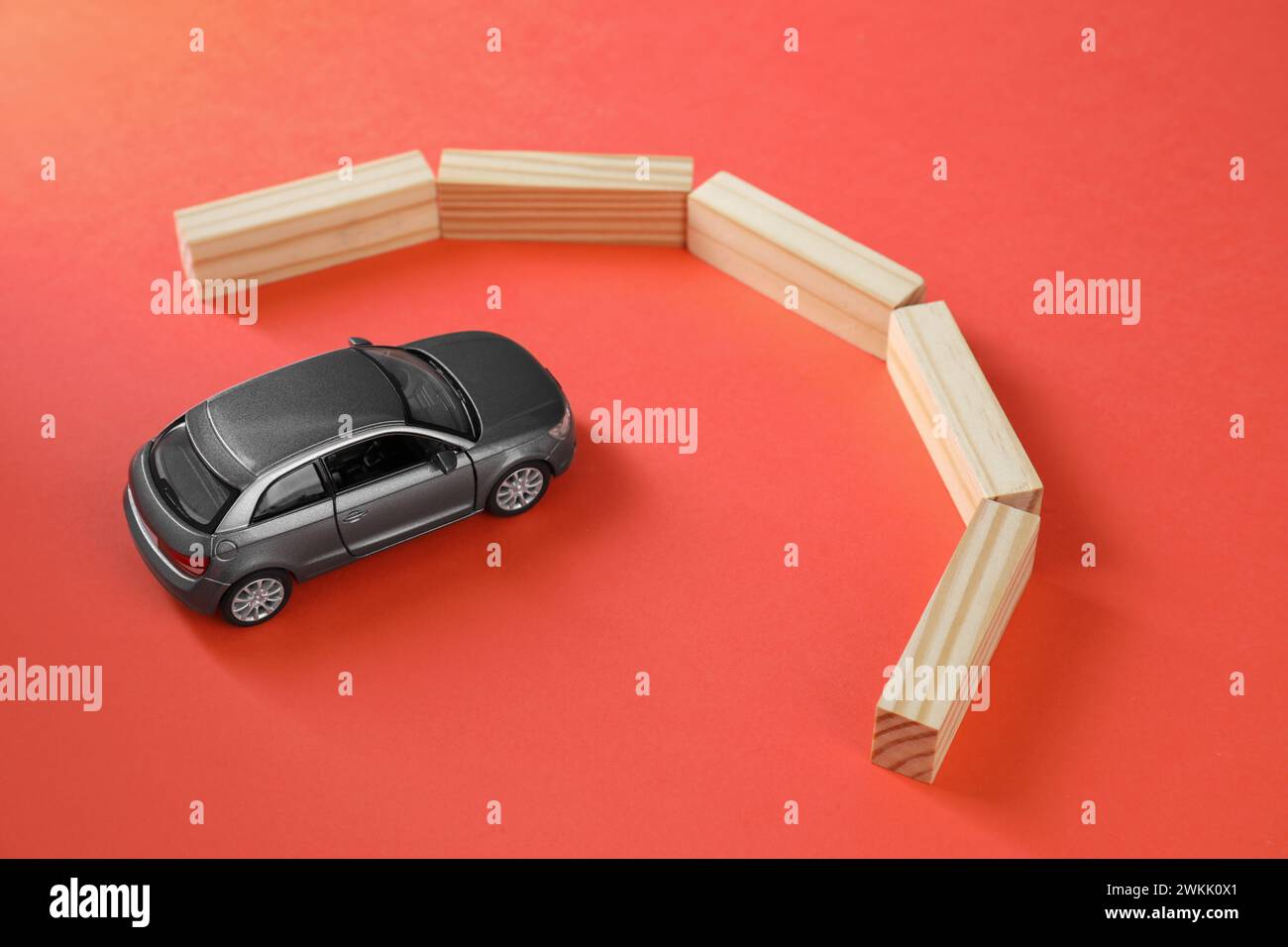 Development through barriers overcoming. Silver toy car movement ...