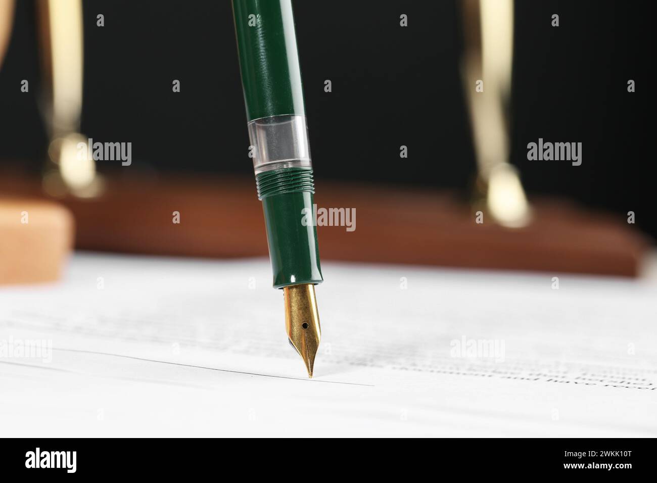 Signing notary document with fountain pen, closeup Stock Photo - Alamy