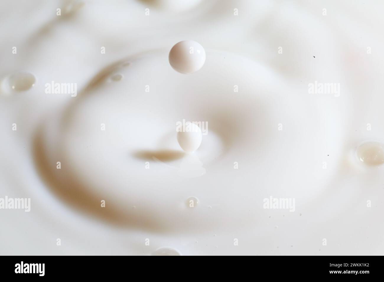 Milk Splash Crown with Suspended Droplet in Macro View Stock Photo - Alamy