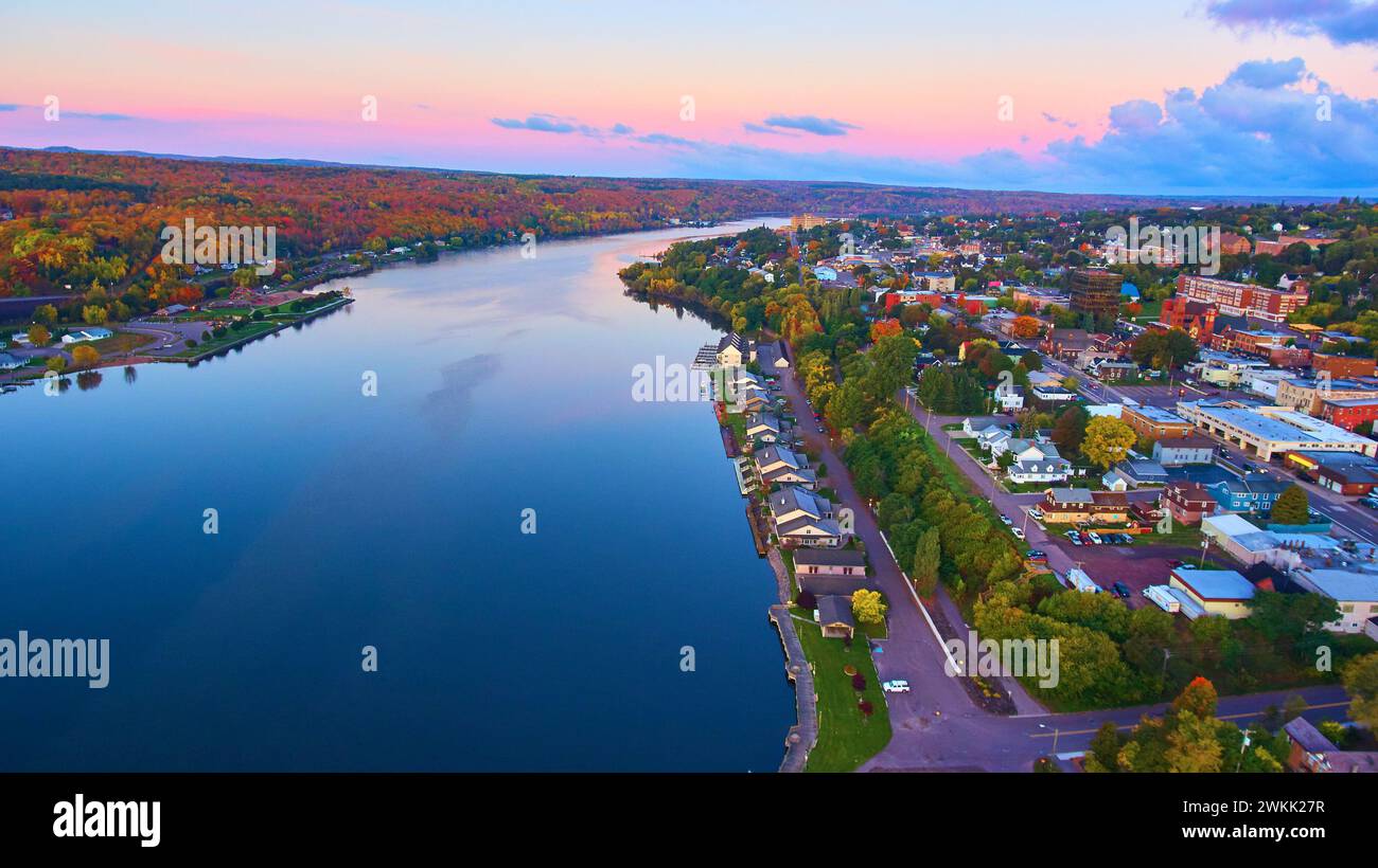 Aerial Twilight Autumn Riverside Town with Reflective Water and Forest ...