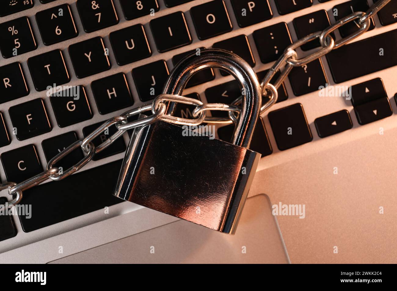Cyber security. Padlock with chain on laptop, top view Stock Photo - Alamy