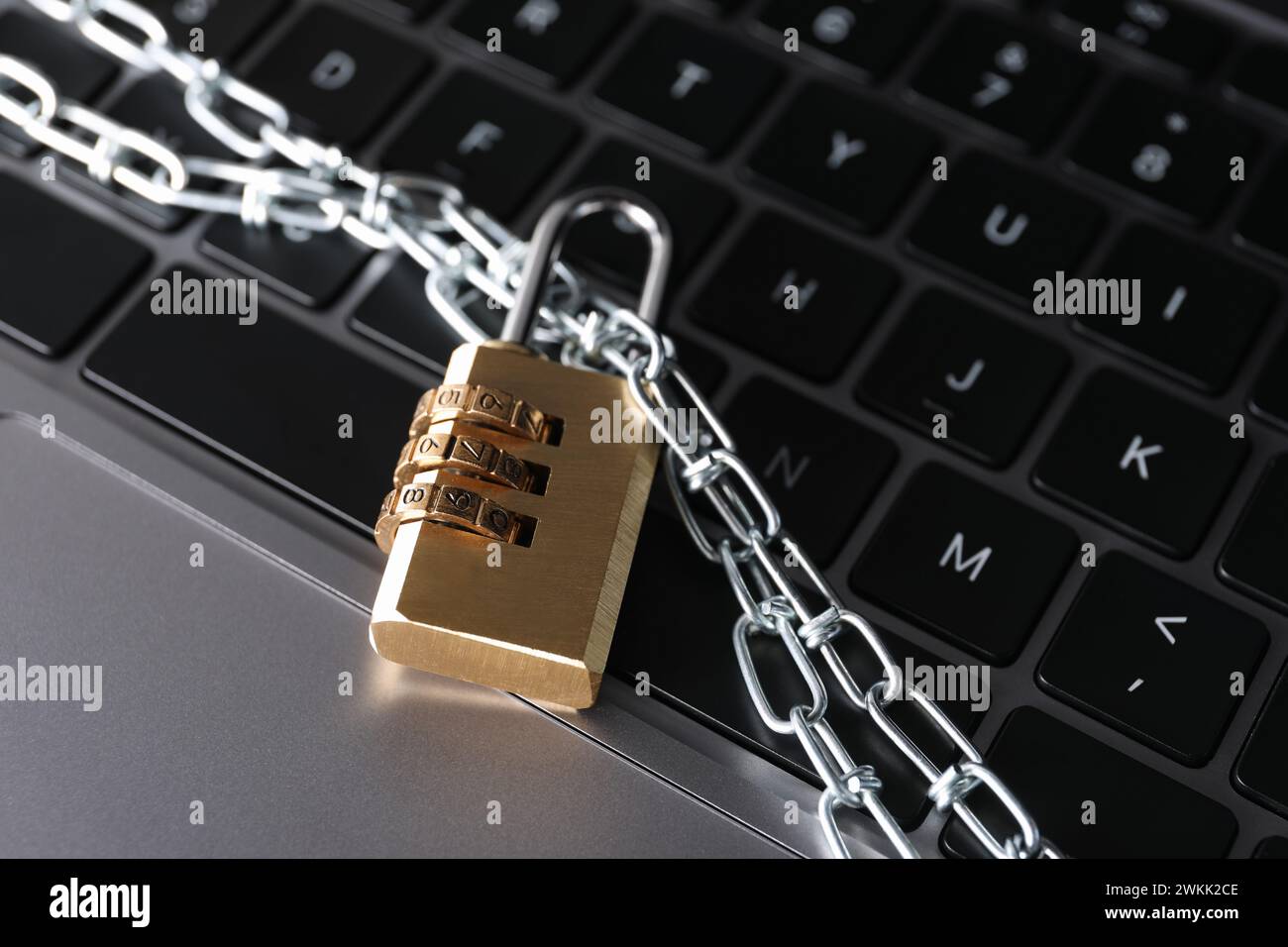 Cyber security. Padlock with chain on laptop, closeup Stock Photo - Alamy
