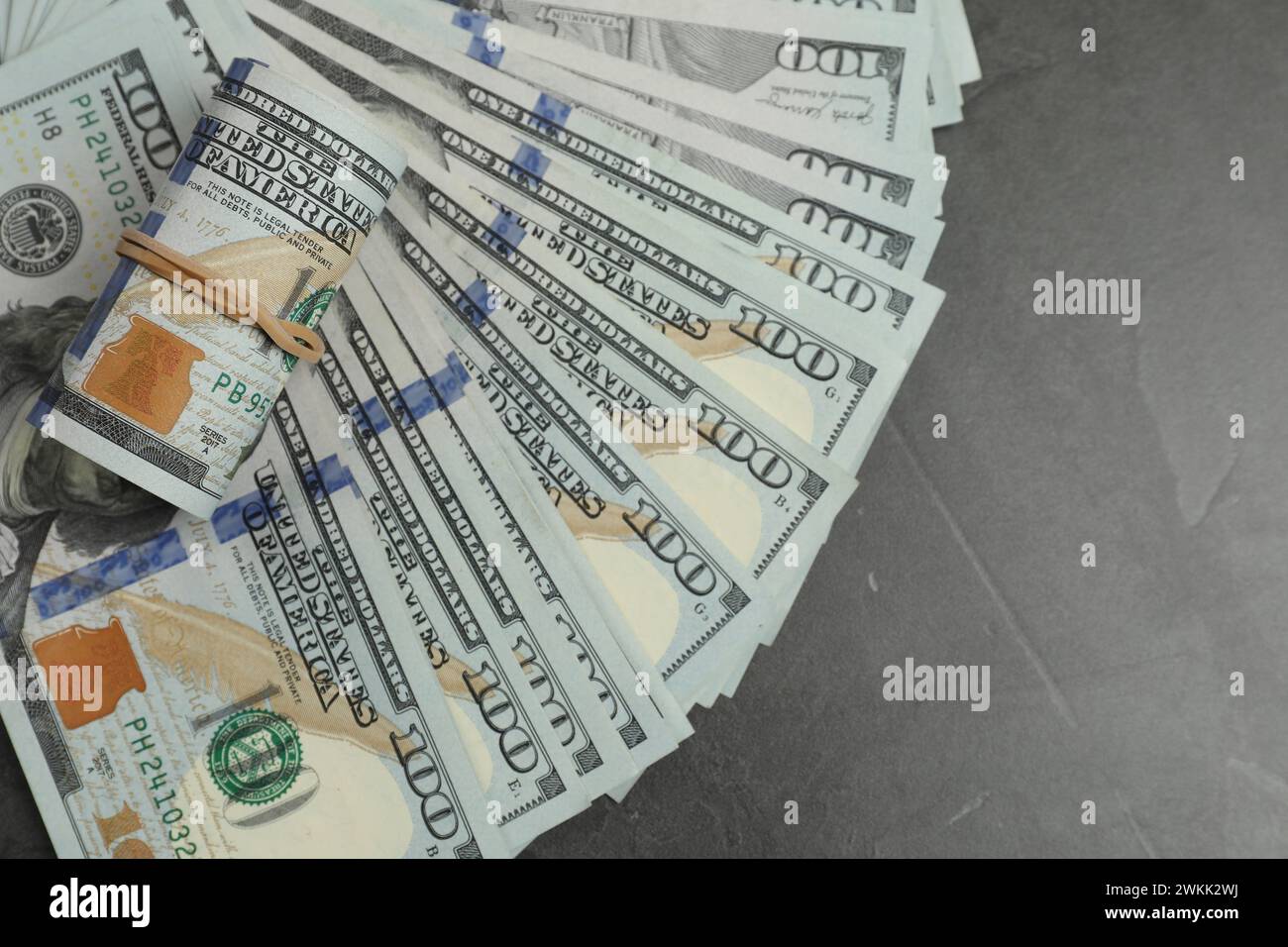 Money exchange. Dollar banknotes on dark gray textured background, top ...