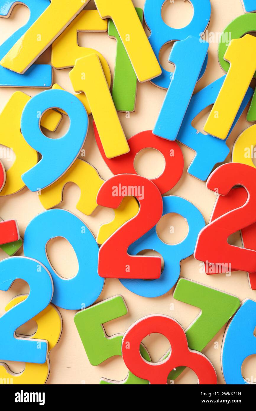 Colorful numbers on beige background, flat lay Stock Photo - Alamy