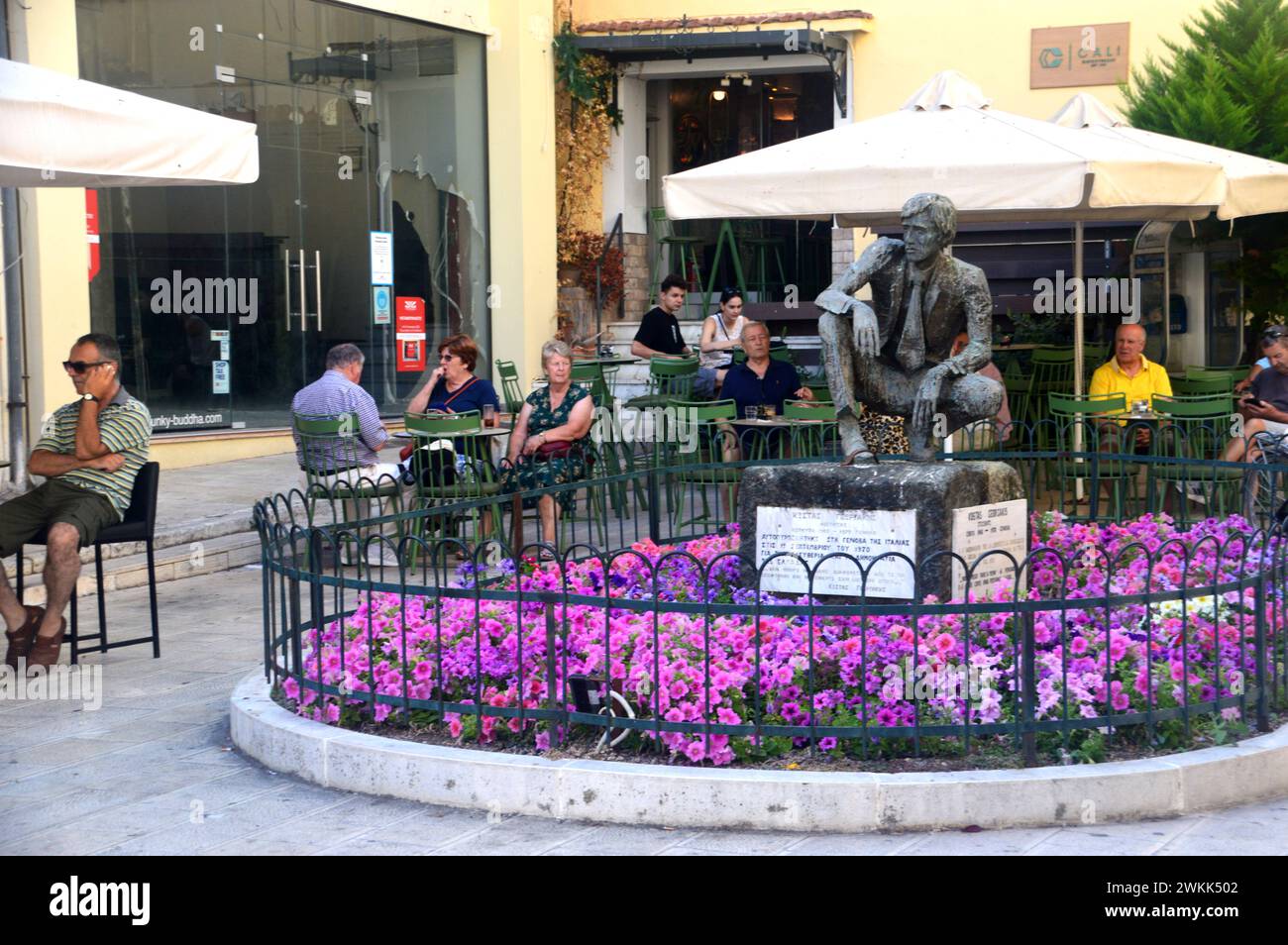 People Eating & Drinking by the Bronze Statue Monument to Kostas ...