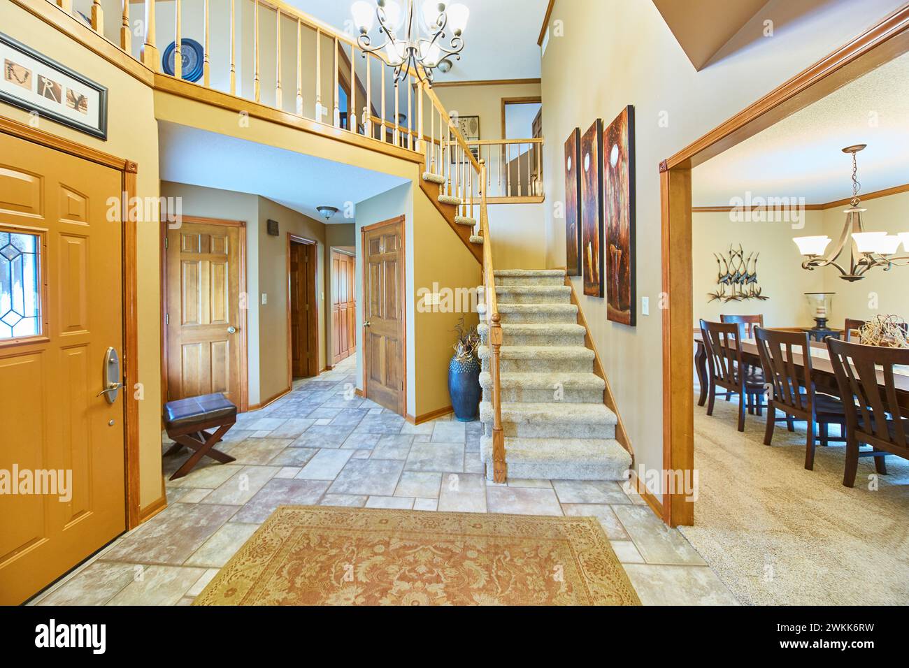 Warm and Inviting Home Interior with Staircase and Dining Area Stock ...