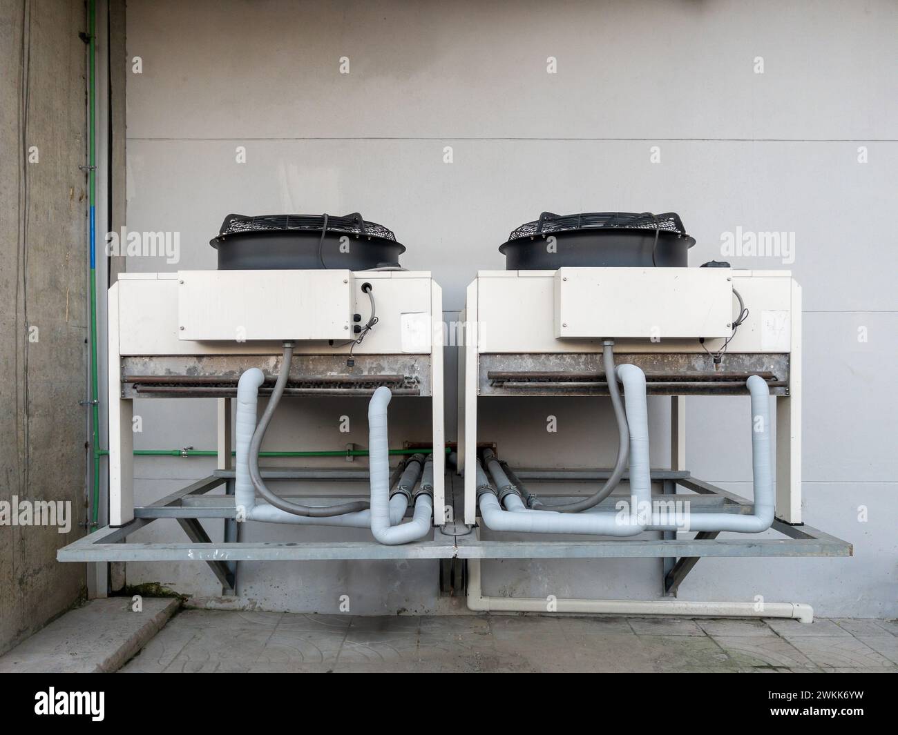 The large compressor unit of the air conditioning system located behind ...