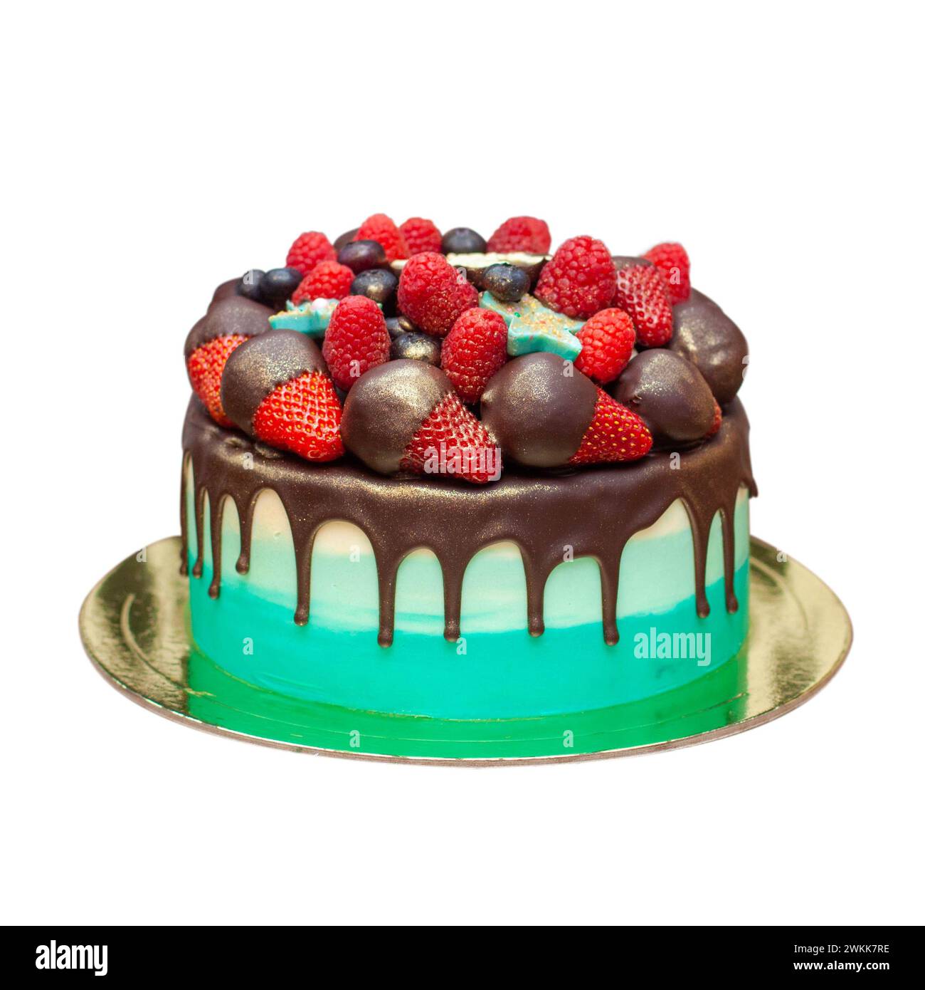 Green Birthday Cake with chocolate ganache and fresh berries isolated ...