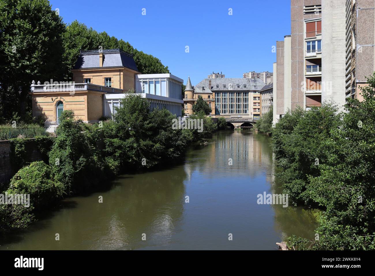 An arm of the Meuse (Maas) river as it runs through the city of Sedan ...