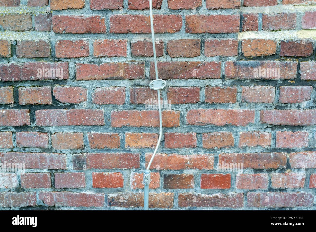 Lightning rod on a brick house wall Stock Photo - Alamy