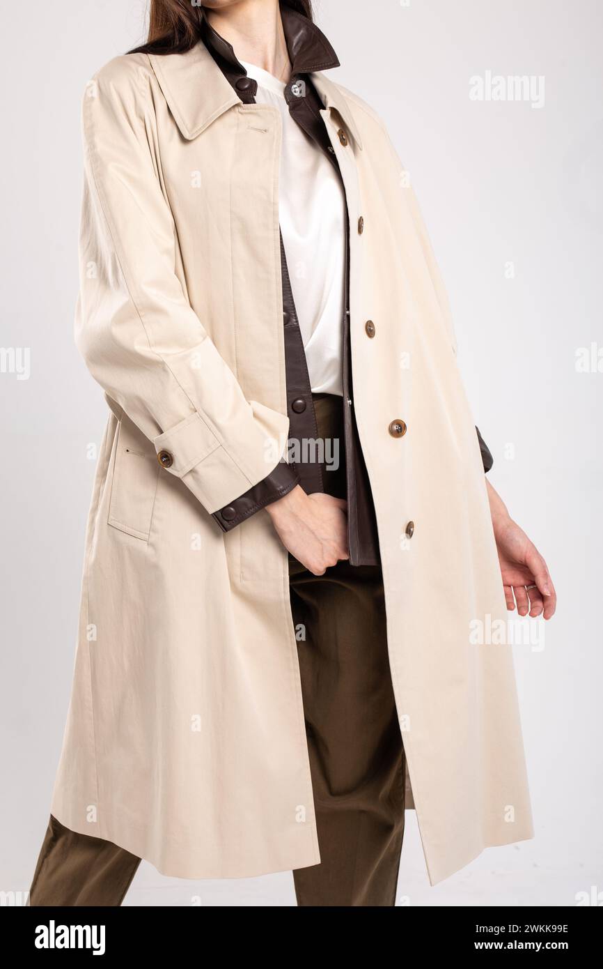 A sophisticated and timeless look for any occasion, this beige trench ...