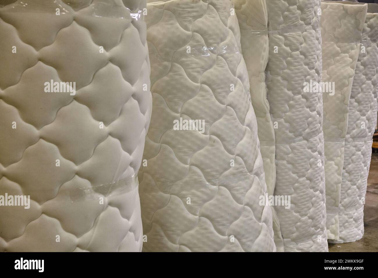 New Mattresses Stacked in Warehouse, Eye-Level View Stock Photo - Alamy