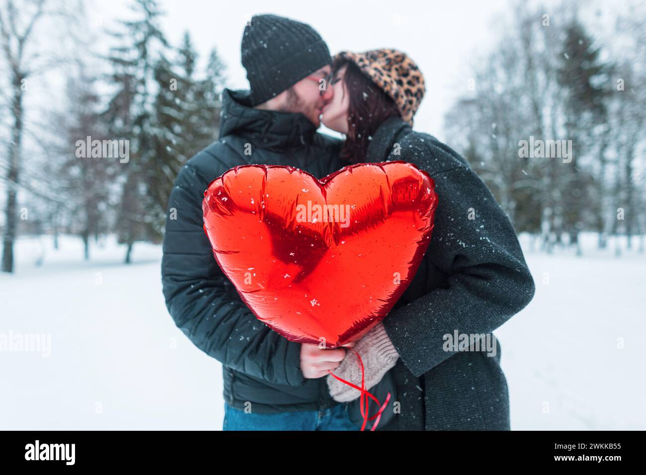 Woman kissing balloon hi-res stock photography and images - Alamy