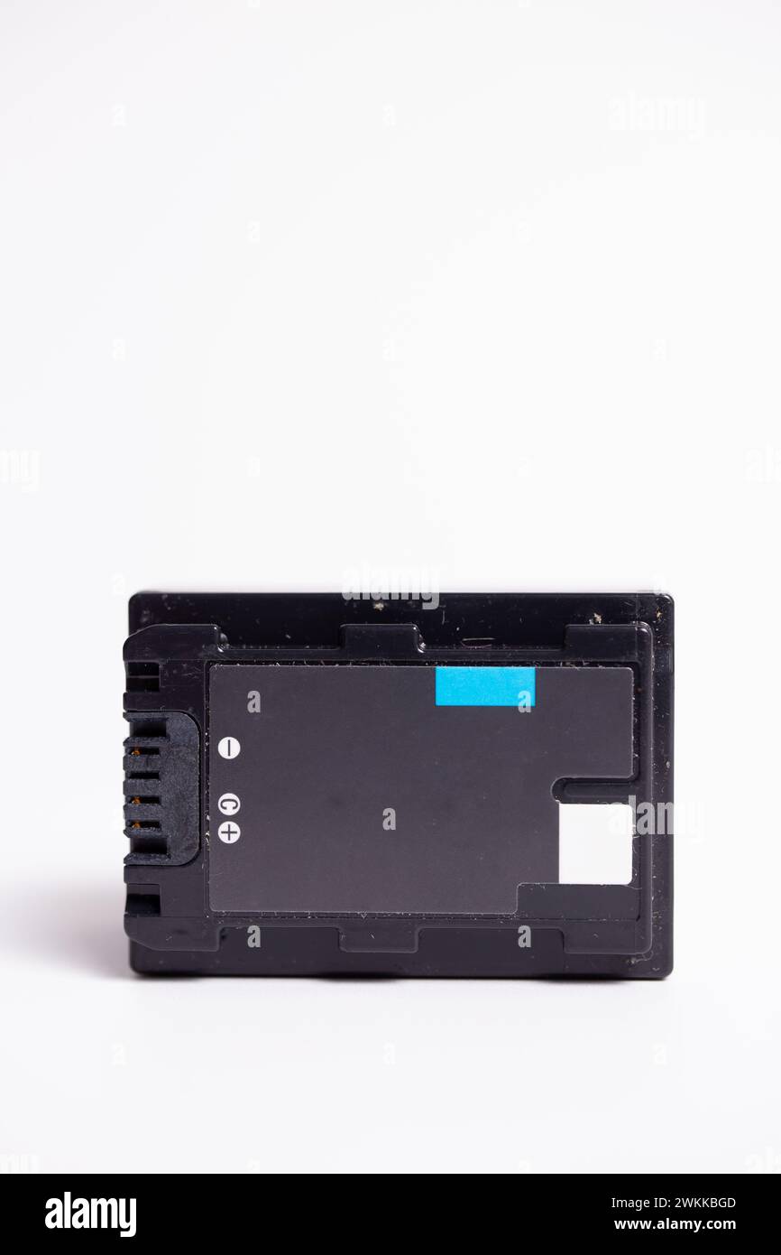 Black rectangular camera battery isolated on white background. The ...