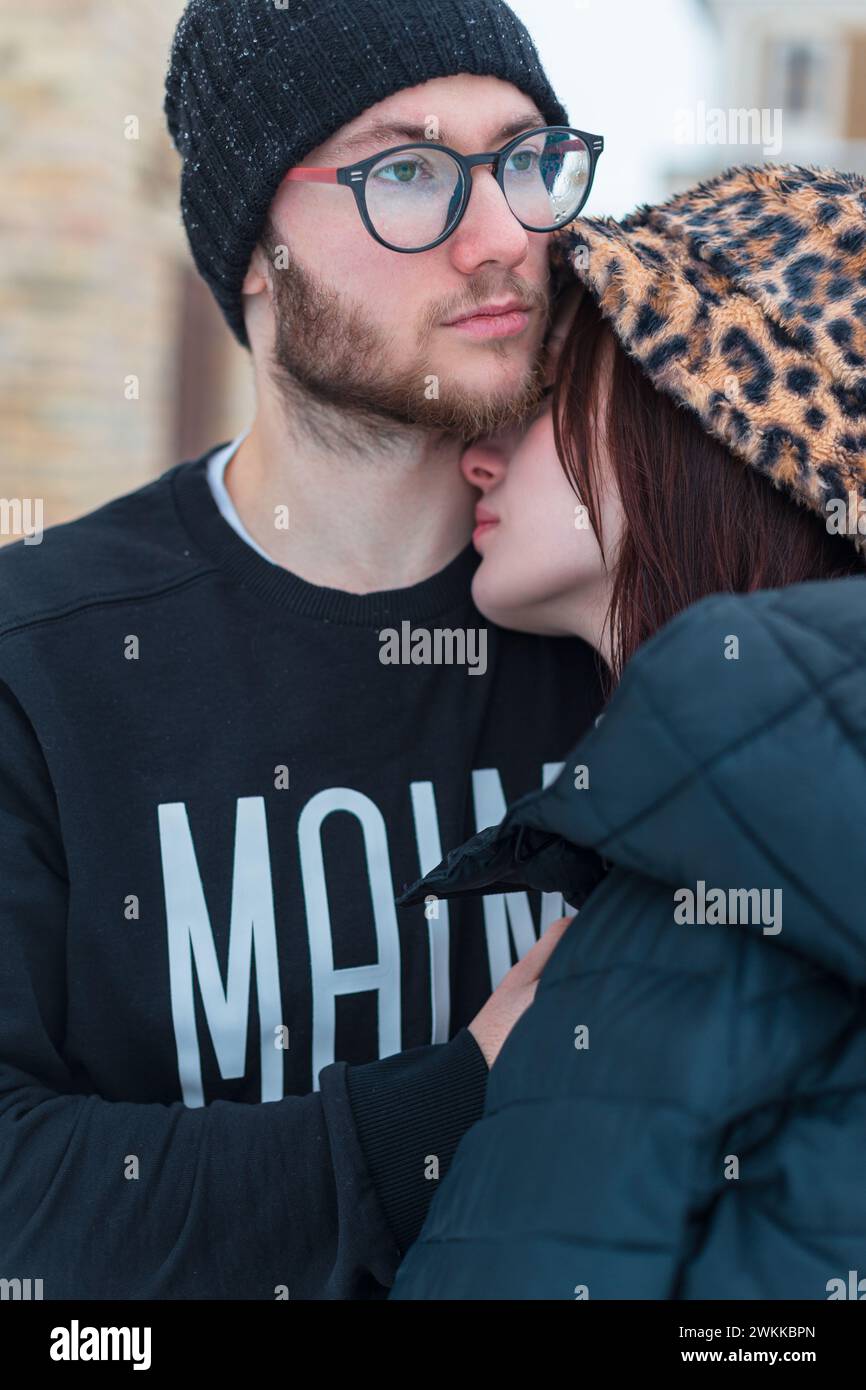Beautiful young couple of lovers in fashionable clothes hugging in the ...