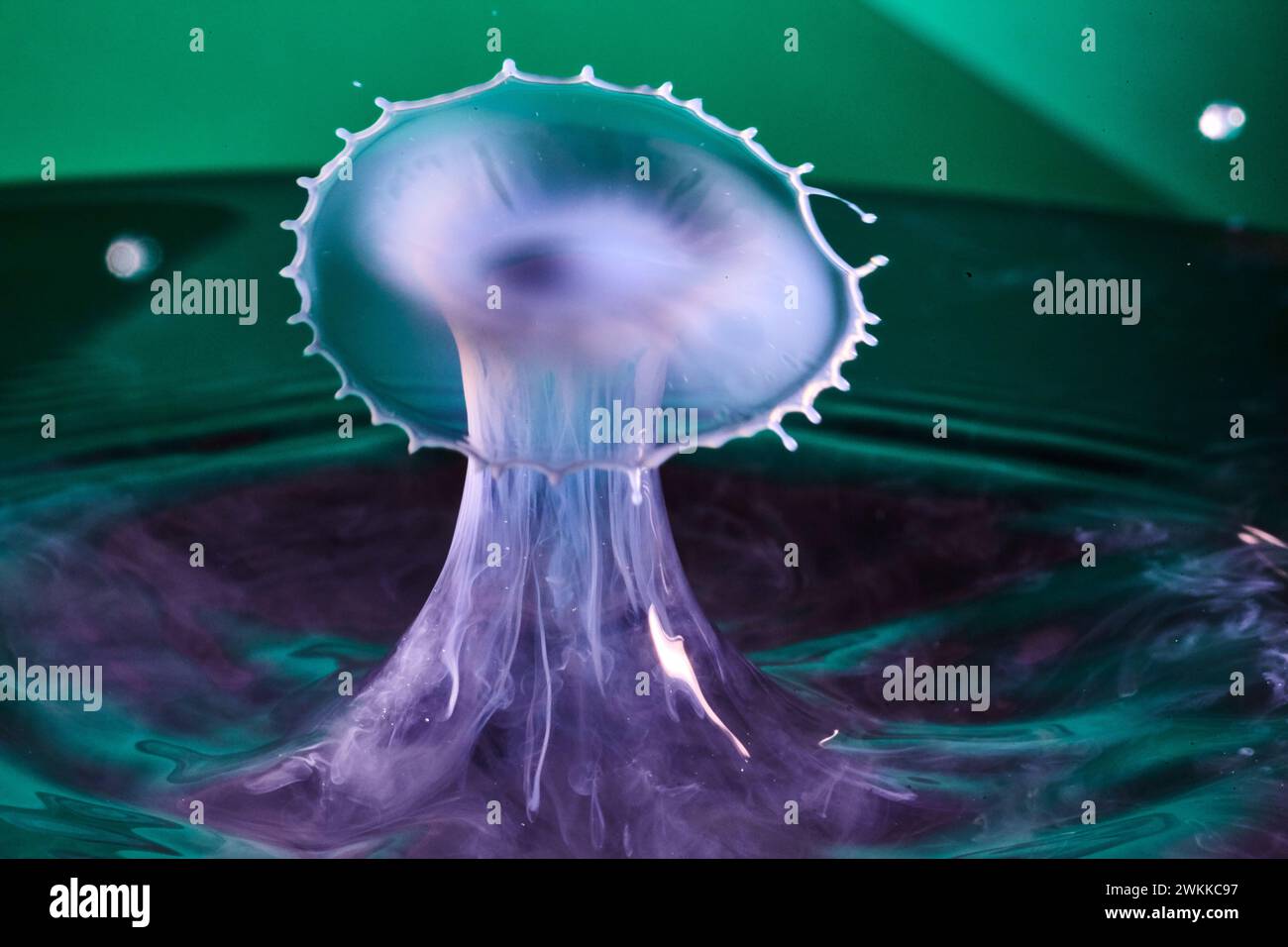 High-Speed Water Drop Splash with Green Background Stock Photo - Alamy
